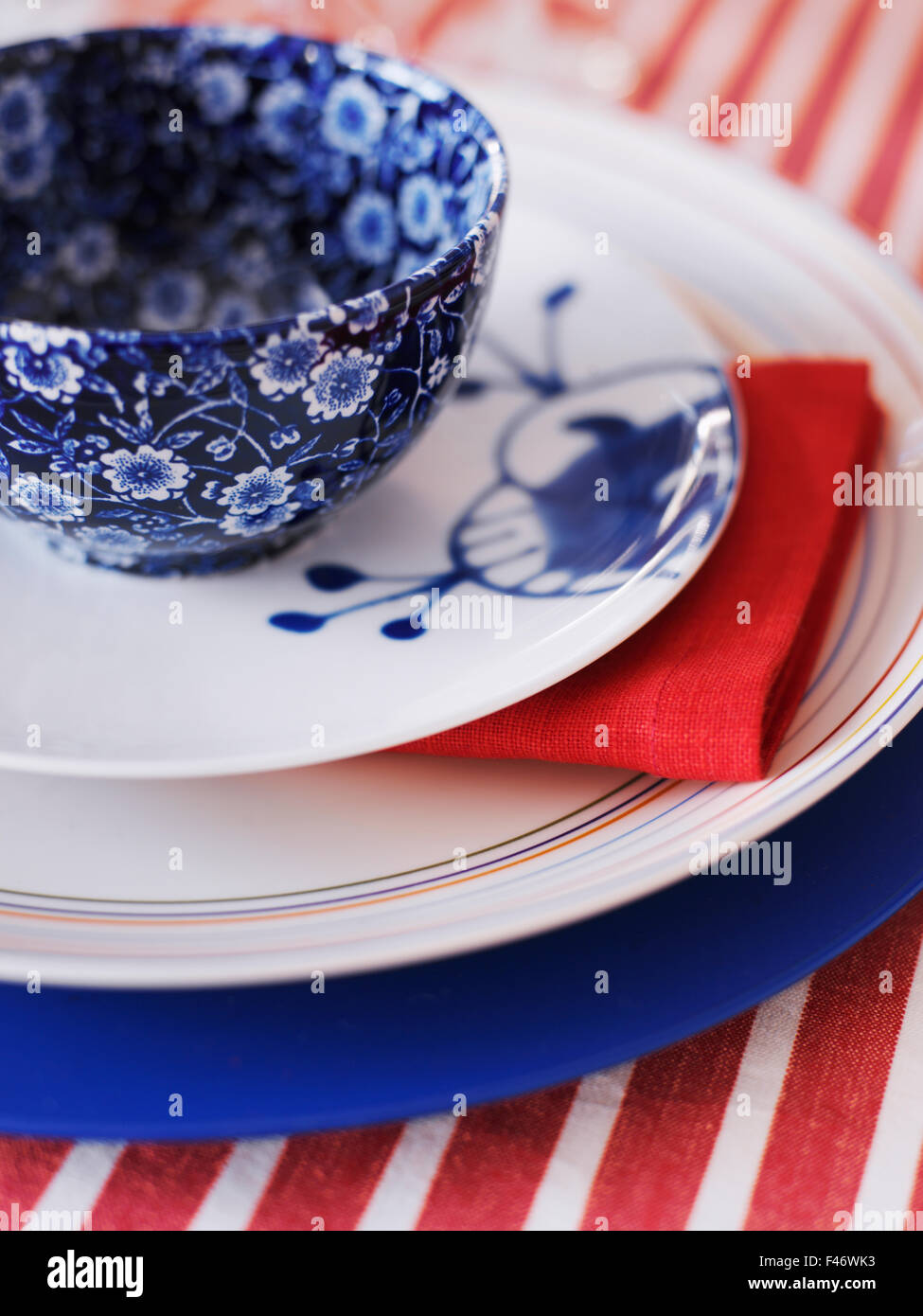 Plates on a set table, close-up Stock Photo - Alamy