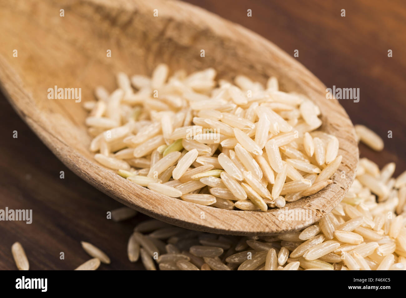 Spoon of brown rice close up Stock Photo - Alamy