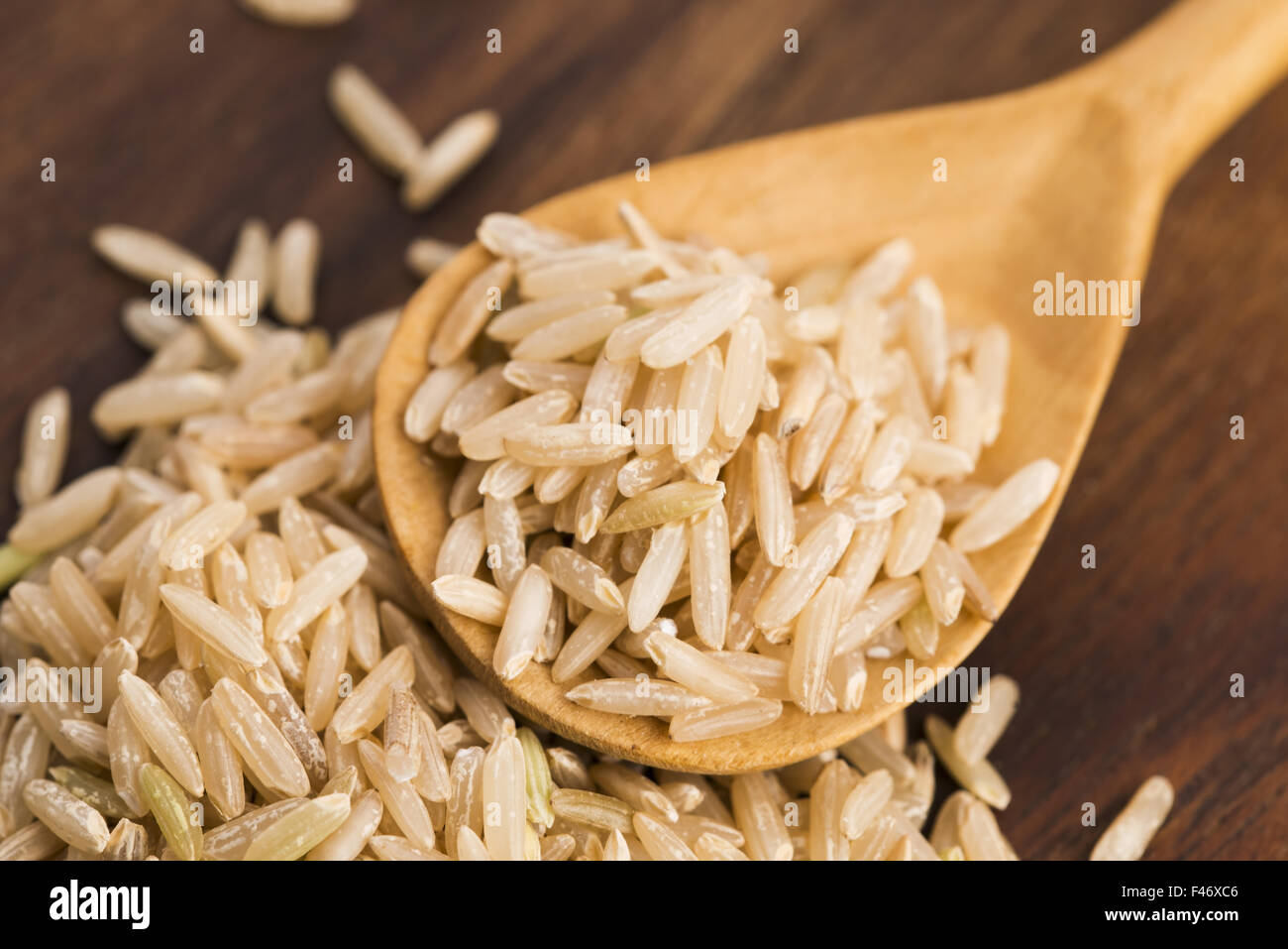 Spoon of brown rice close up Stock Photo - Alamy