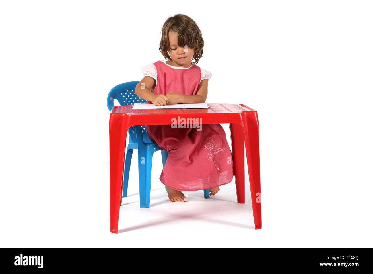young girl sitted at the desk Stock Photo - Alamy