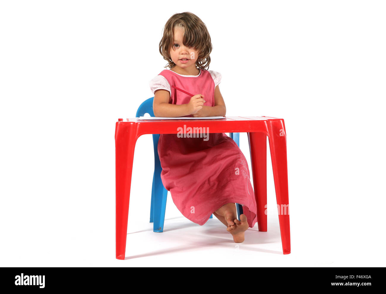 young girl sitted at the desk Stock Photo - Alamy