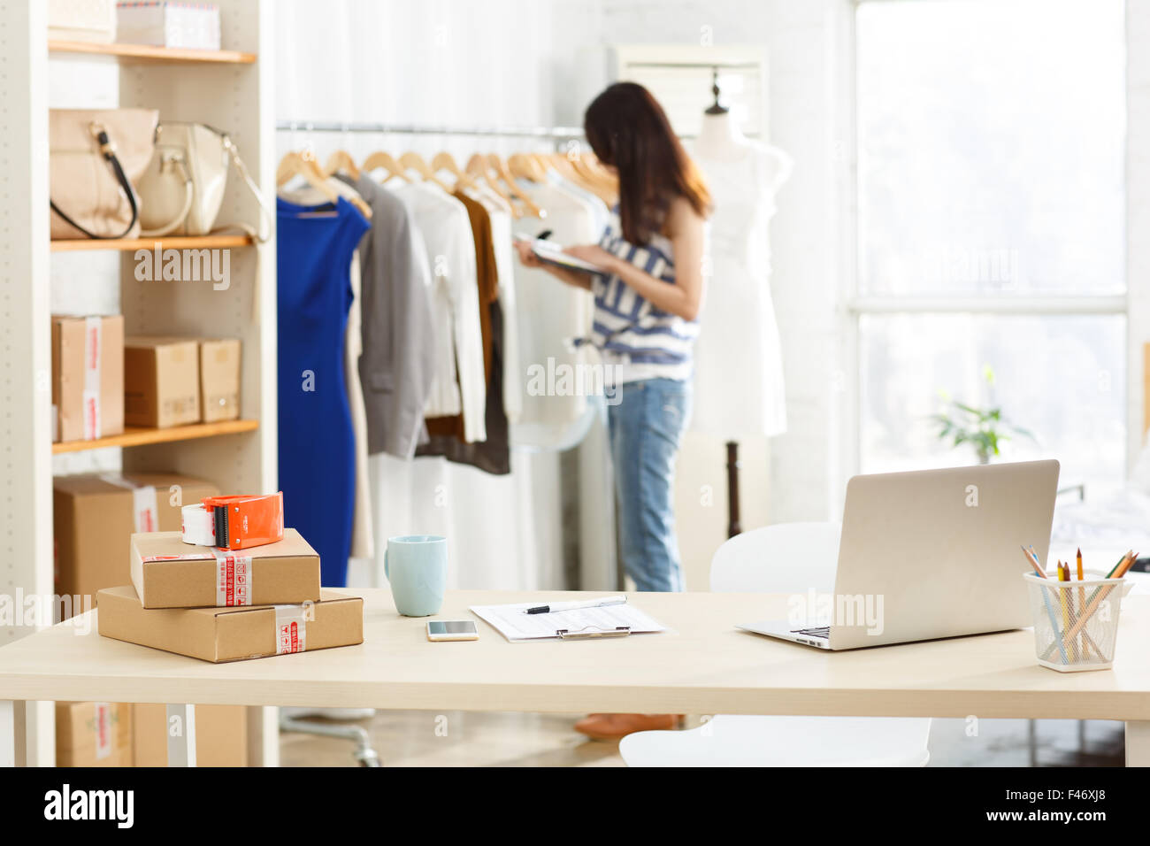 Portrait of fashion designer in studio Stock Photo - Alamy
