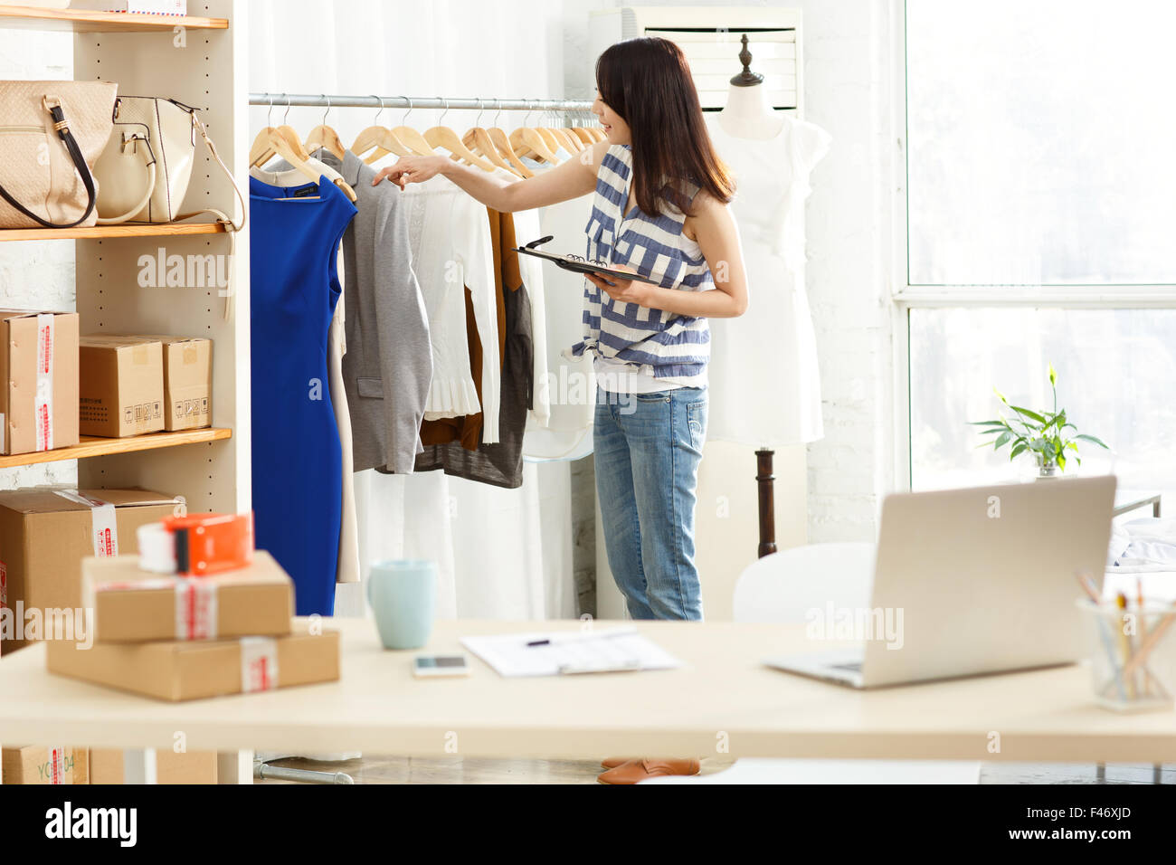Portrait of fashion designer in studio Stock Photo - Alamy