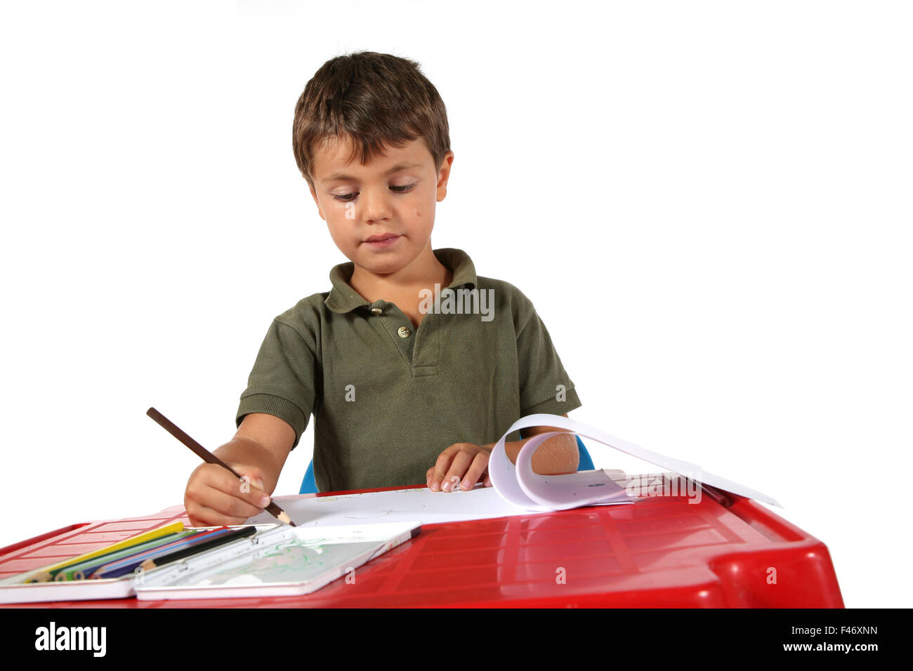 young boy sitted at the desk Stock Photo - Alamy