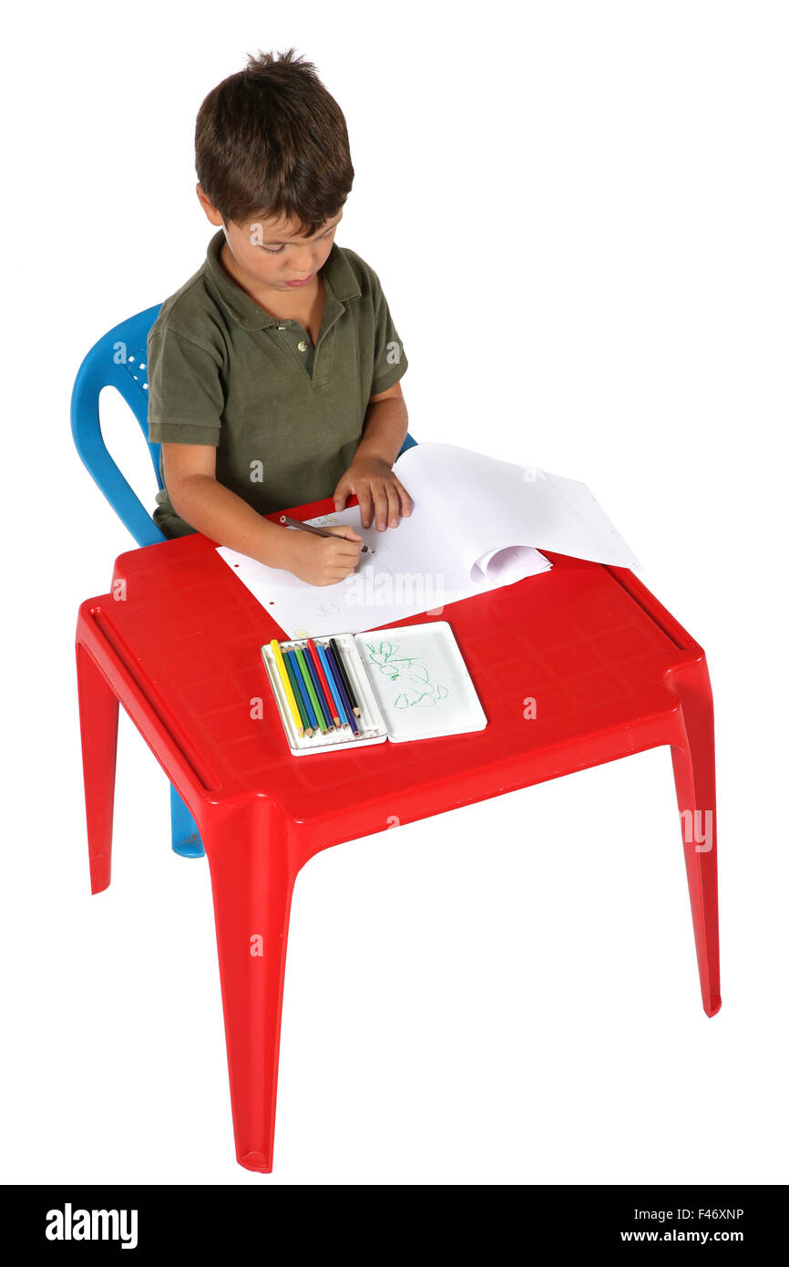 young boy sitted at the desk Stock Photo - Alamy