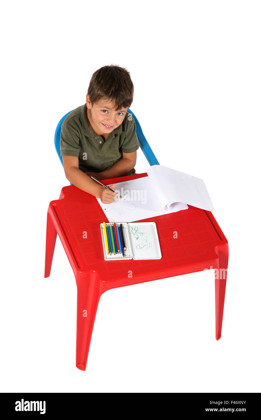 young boy sitted at the desk Stock Photo - Alamy