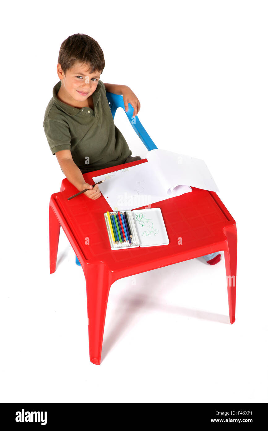 young boy sitted at the desk Stock Photo - Alamy