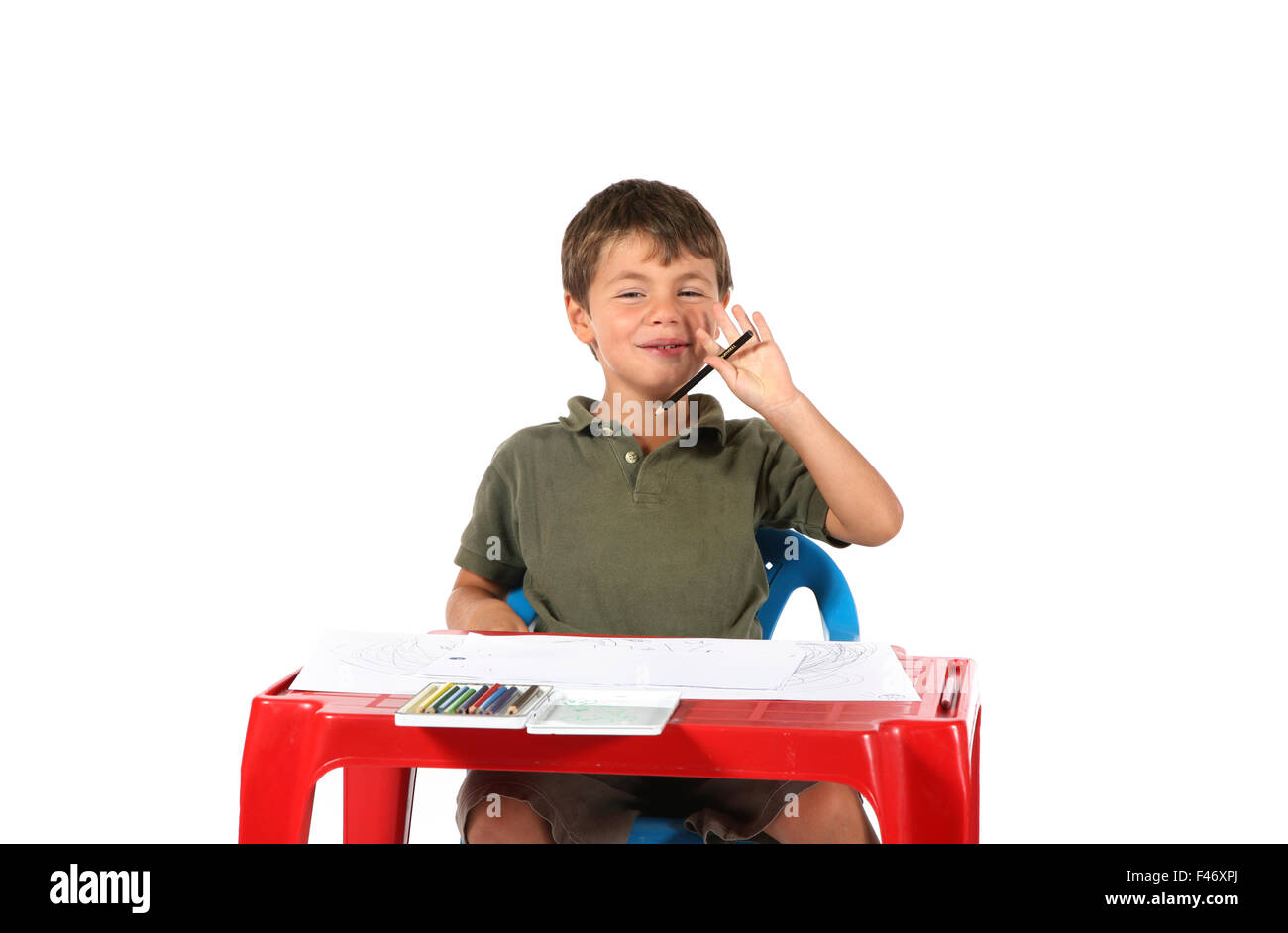 young boy sitted at the desk Stock Photo - Alamy