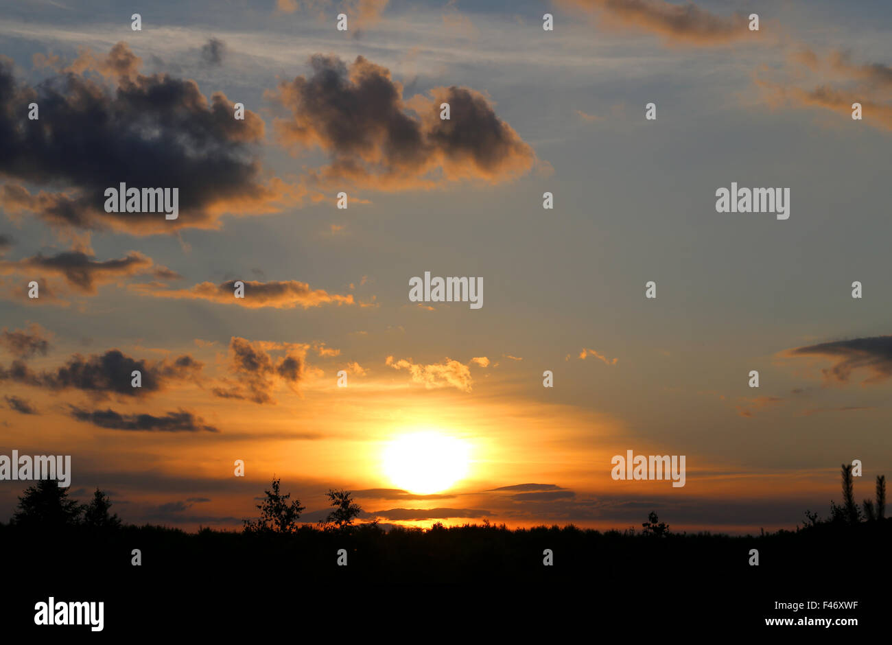 beautiful landscape with a sunset sky over the field Stock Photo - Alamy