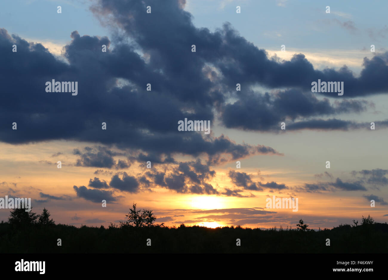 beautiful landscape with a sunset sky over the field Stock Photo - Alamy