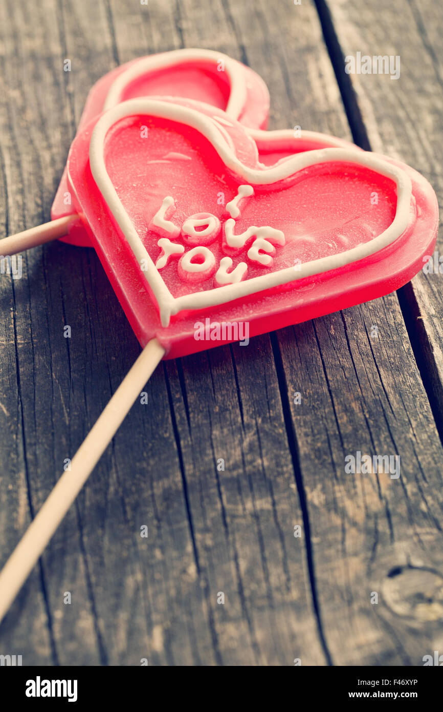 Lollipop heart on a vintage wooden background Stock Photo - Alamy