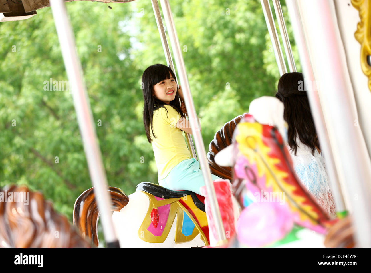 Three girls on amusement ride hi-res stock photography and images - Alamy