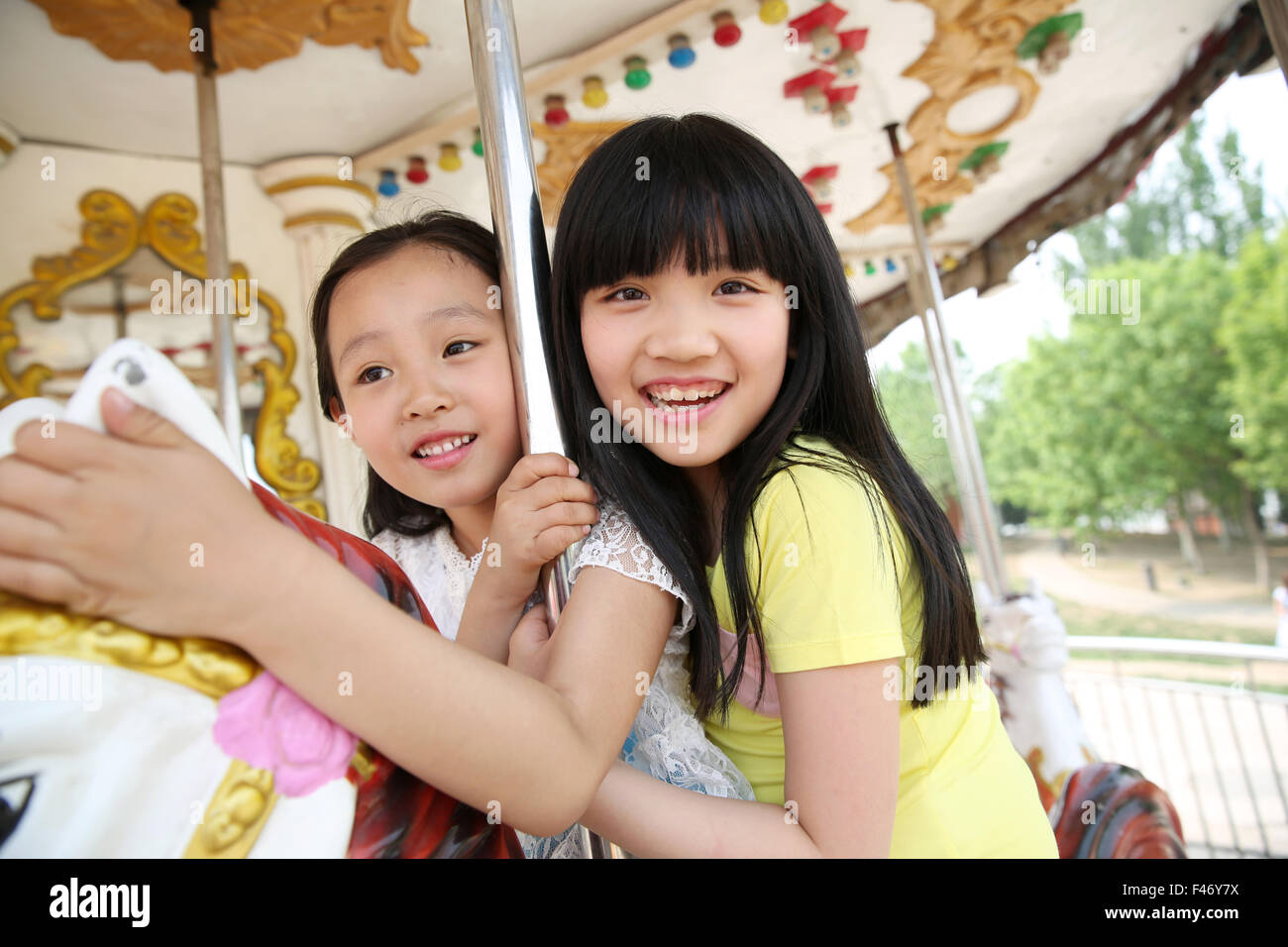 Girls ride on merry hi-res stock photography and images - Alamy