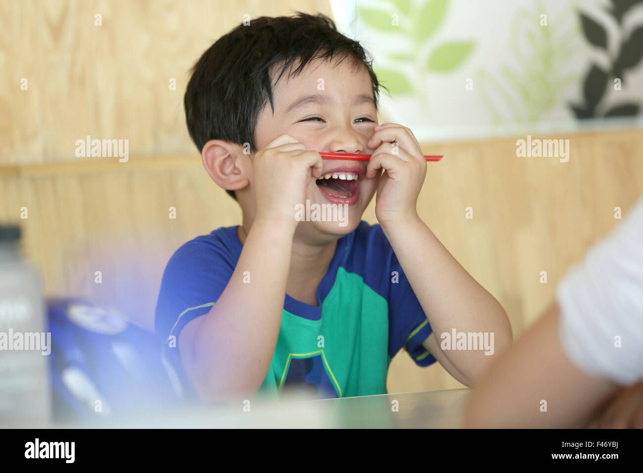 Portrait of boy laughing Stock Photo - Alamy