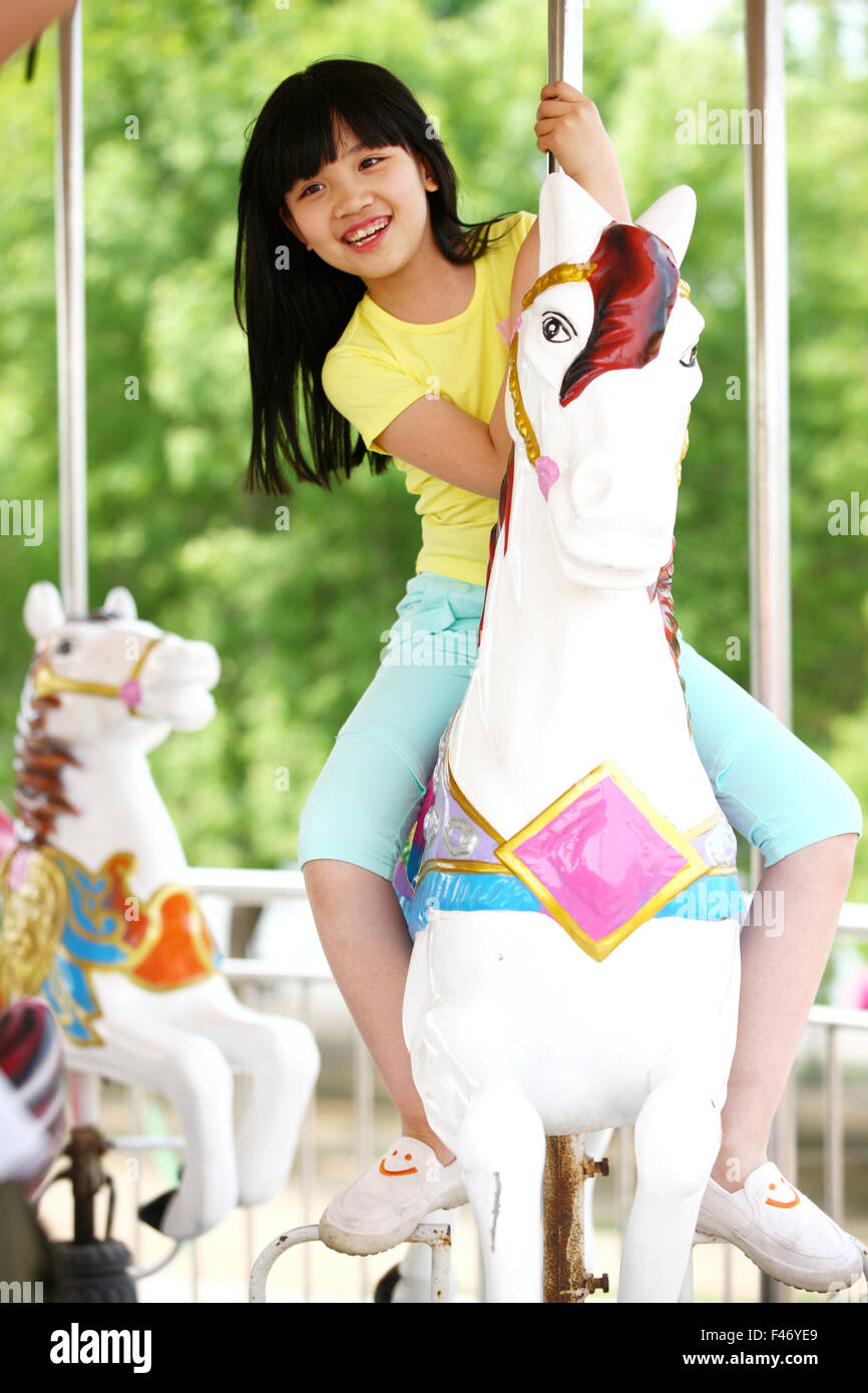 Girls ride on merry hi-res stock photography and images - Alamy