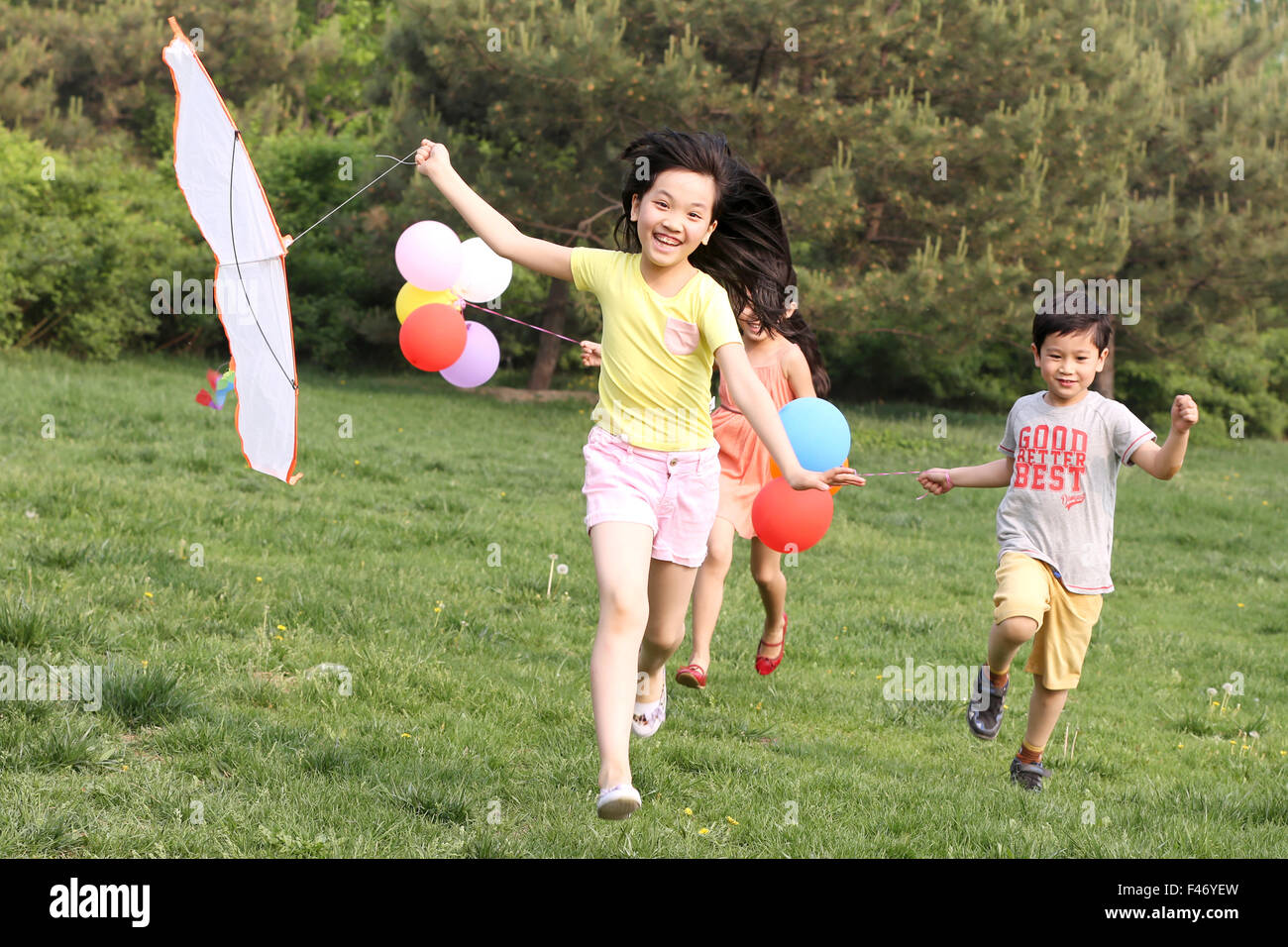 Children playing in field Stock Photo - Alamy