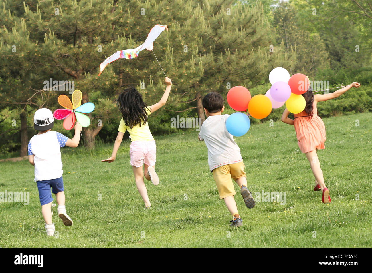 Children playing in field Stock Photo - Alamy