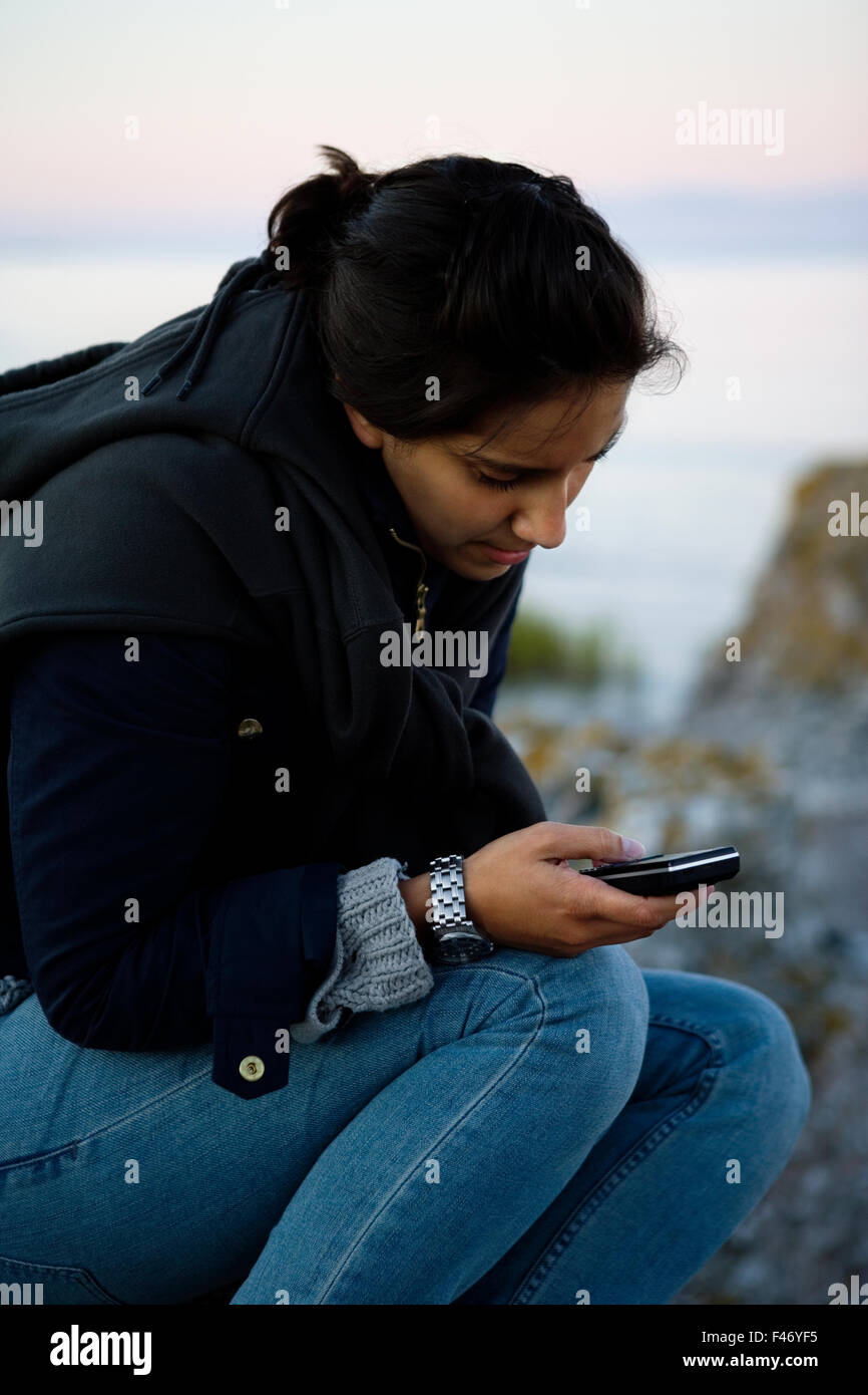 A woman using a mobile phone, Sweden Stock Photo - Alamy
