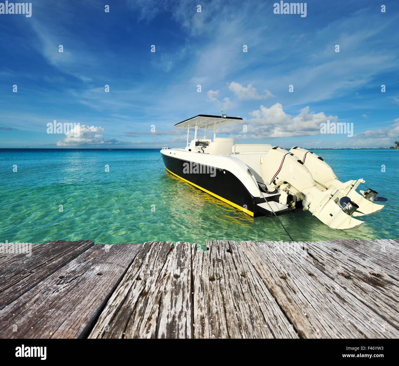 Beautiful beach with motor boat Stock Photo - Alamy