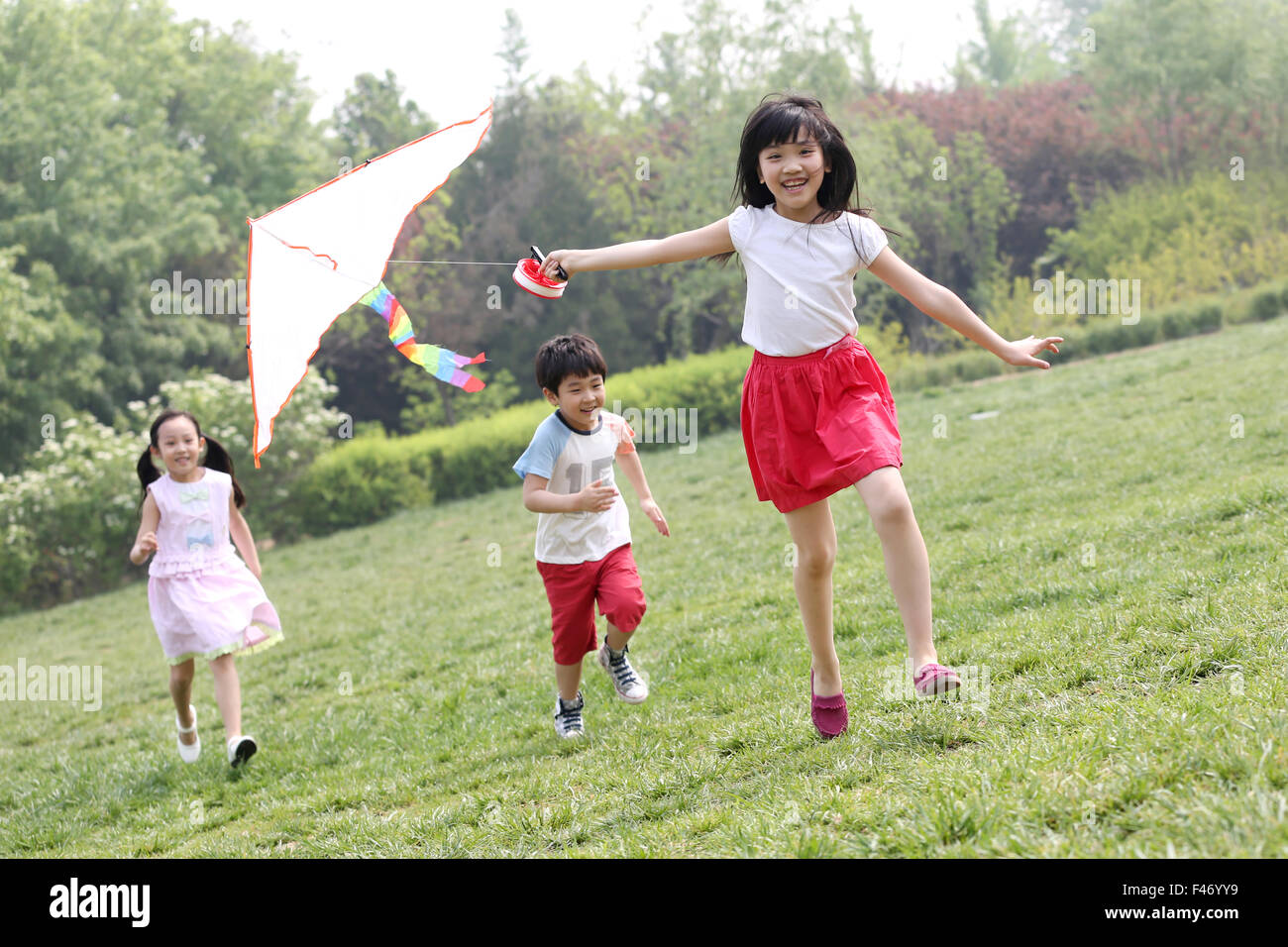 Children playing kite outdoors Stock Photo - Alamy