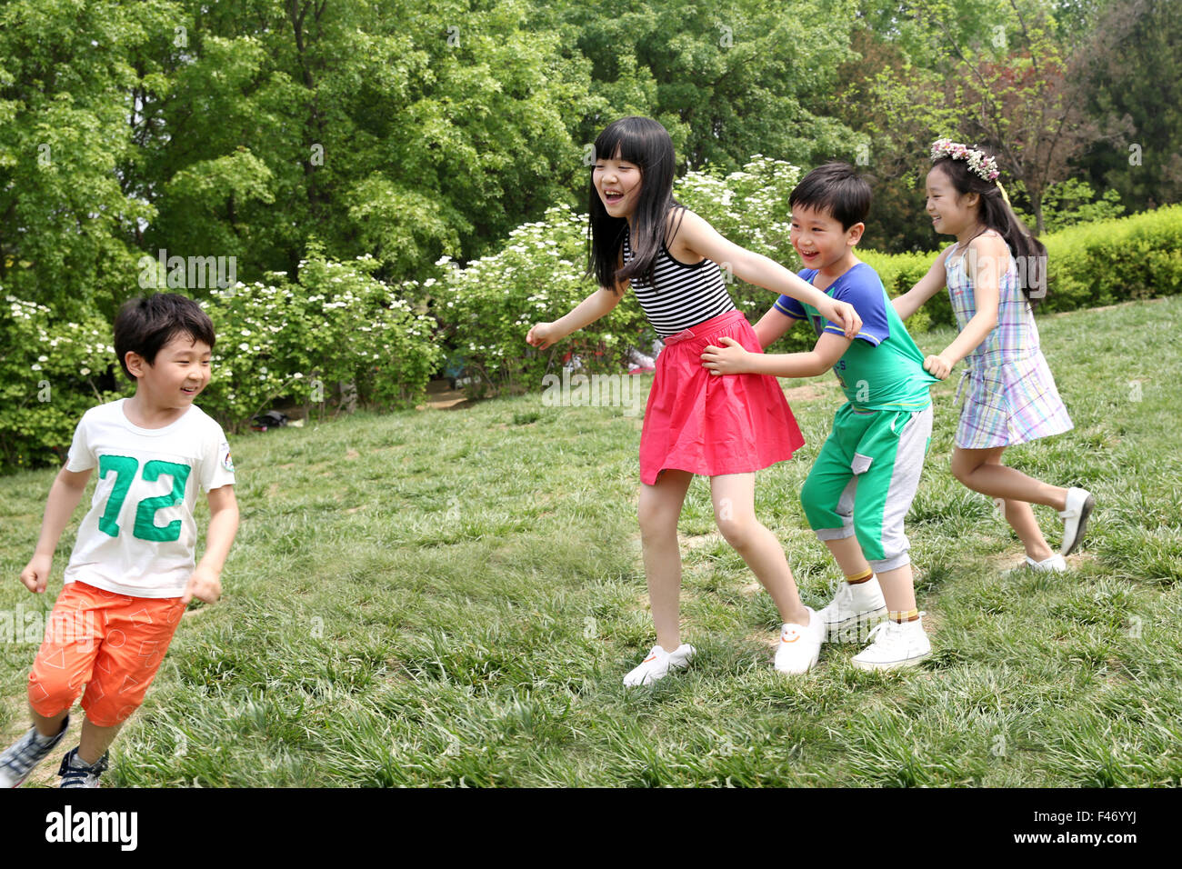 Children playing games in field Stock Photo - Alamy