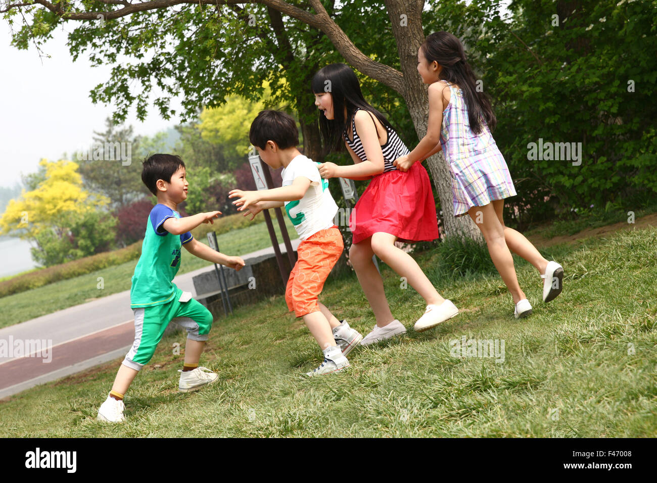 Children playing games in field Stock Photo - Alamy