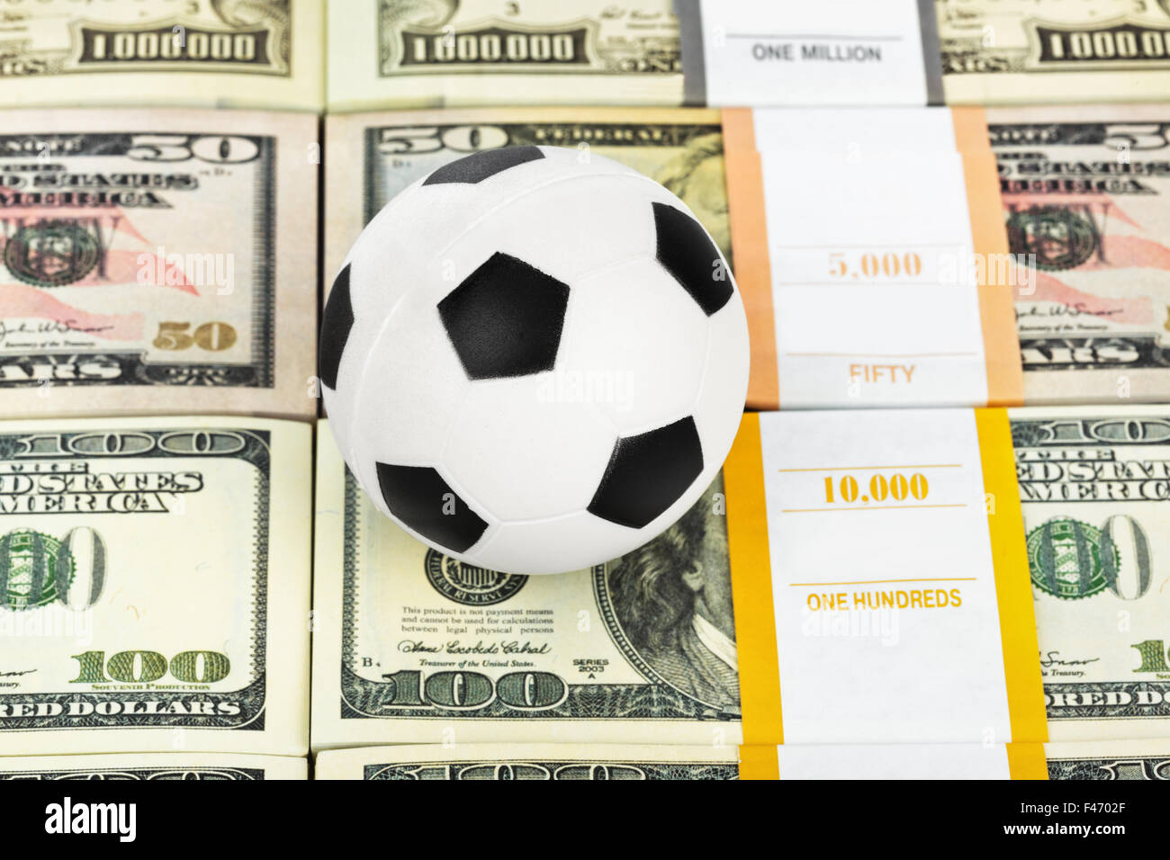 Money and soccer ball Stock Photo - Alamy