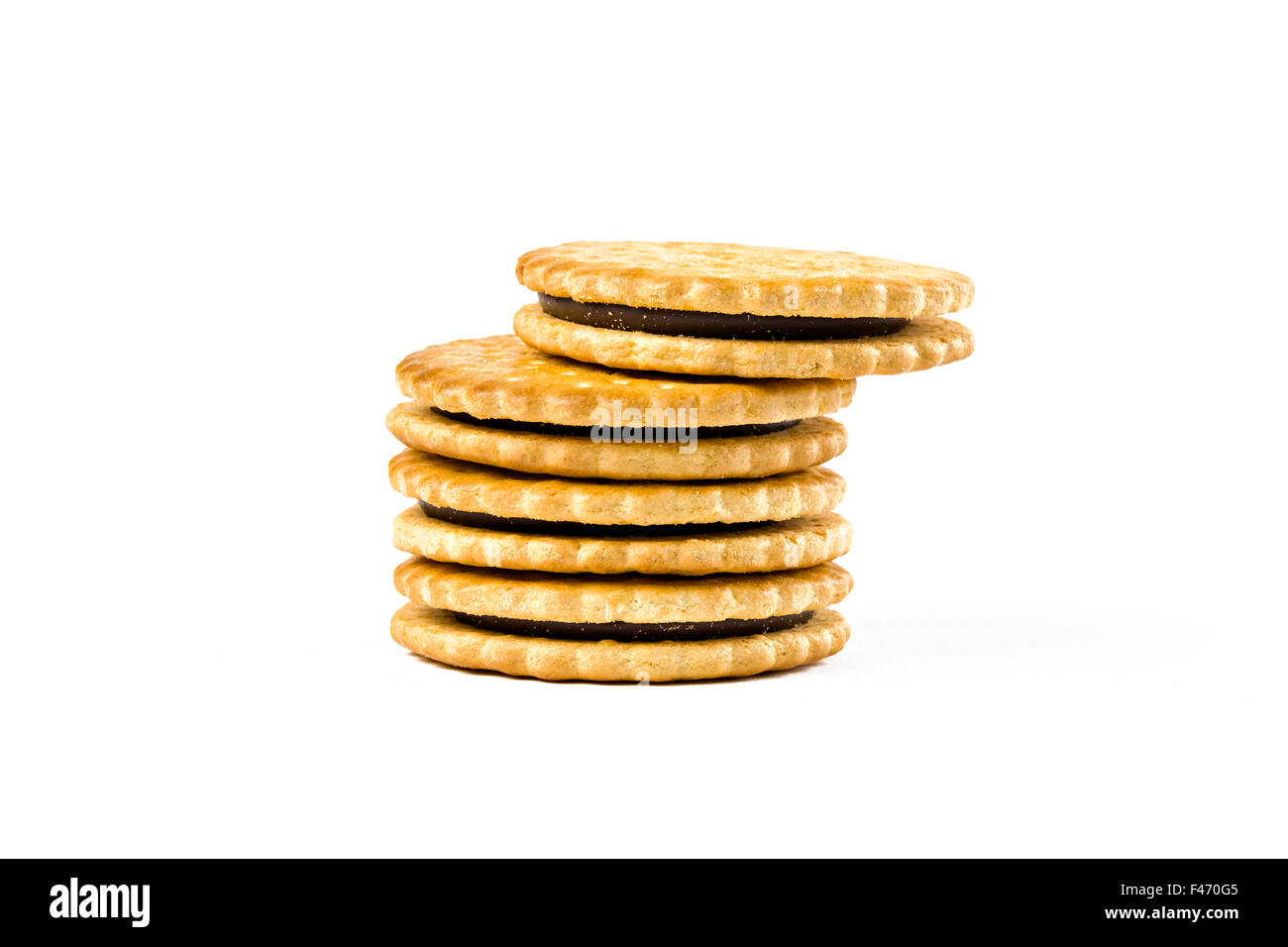 Stack of chocolate filled sweet biscuits with packet, white background ...