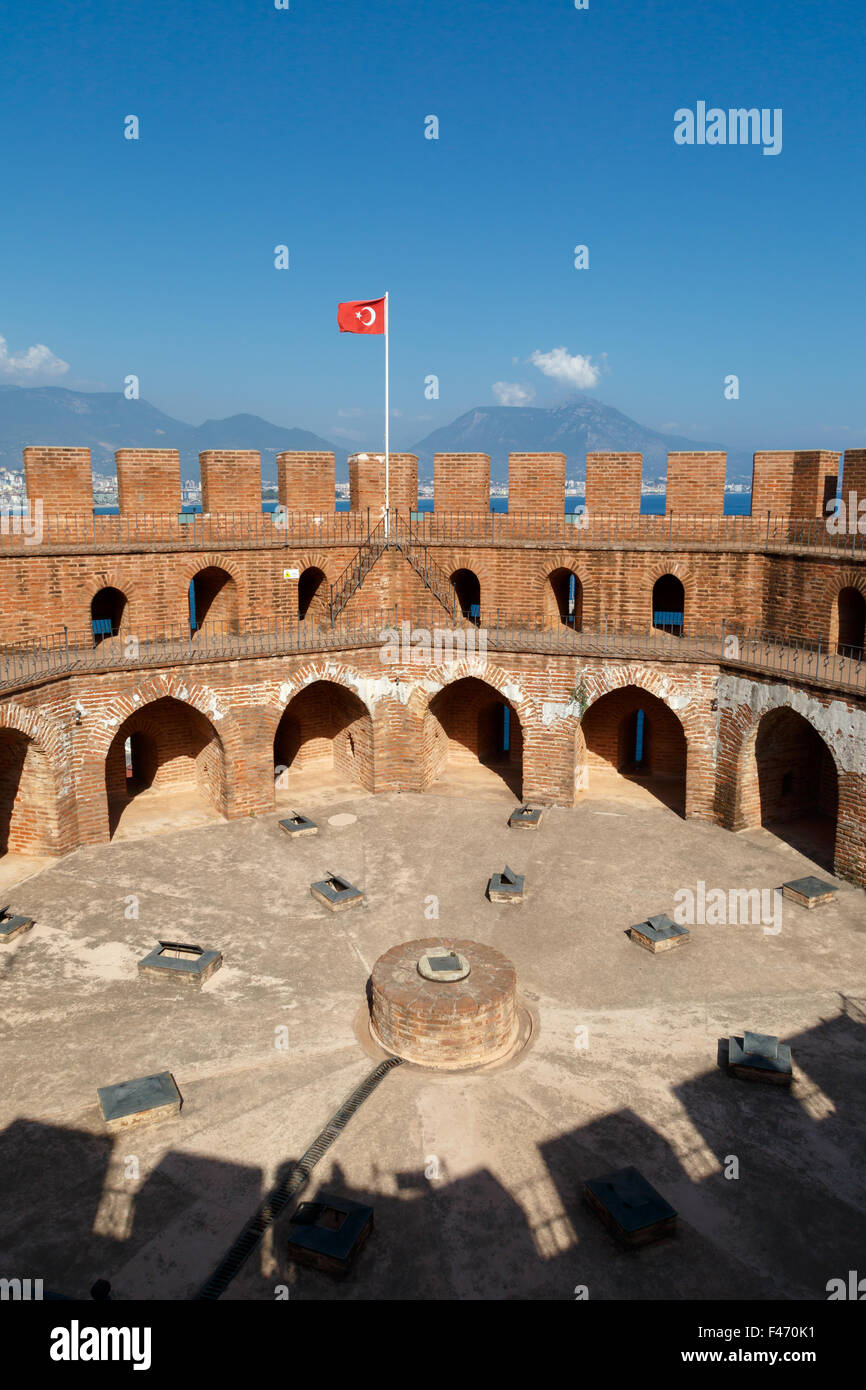 View of Alanya Red Tower in Antalya with orenge bricks, on bright blue ...