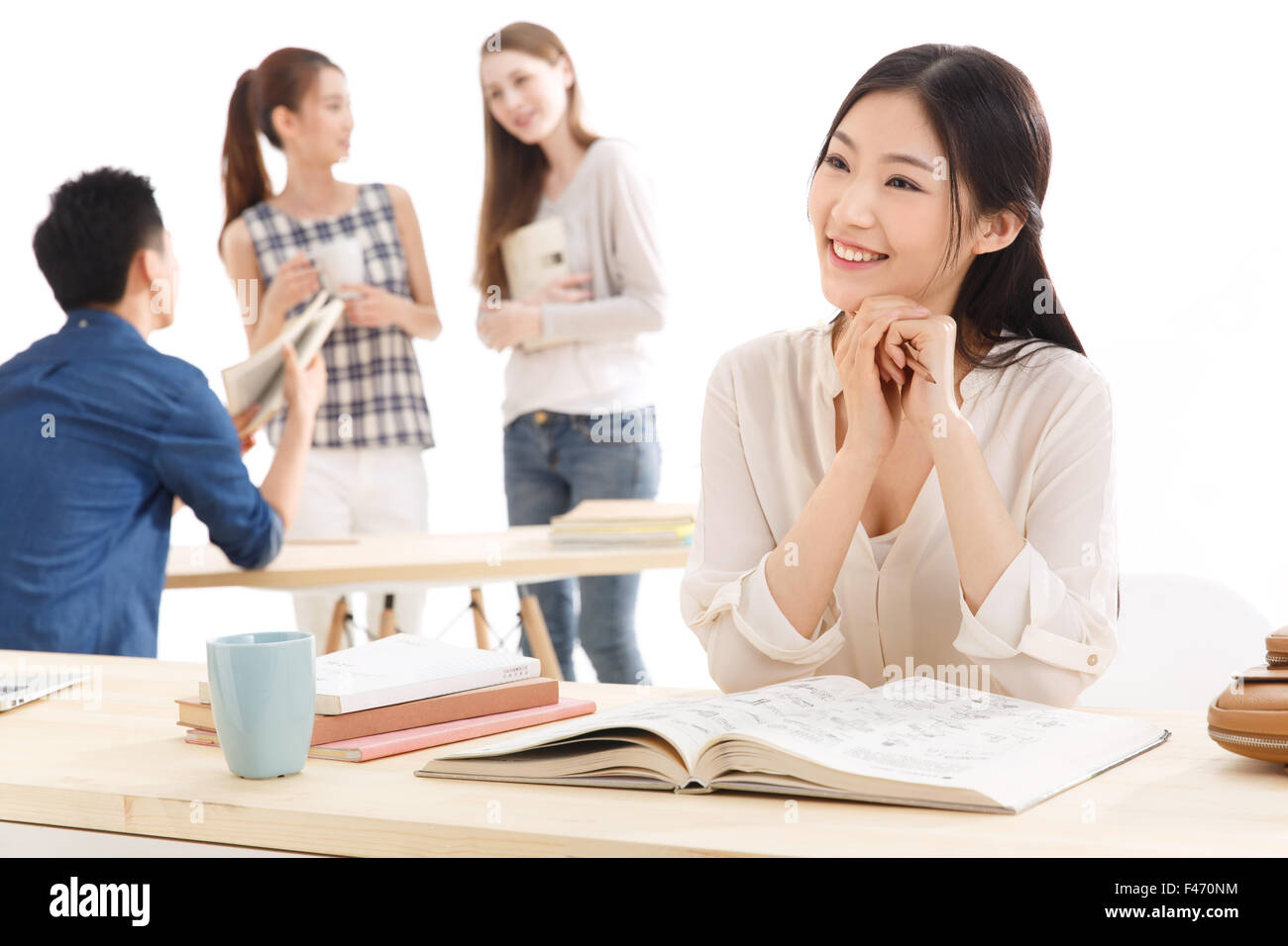 Young woman studying in classroom Stock Photo - Alamy
