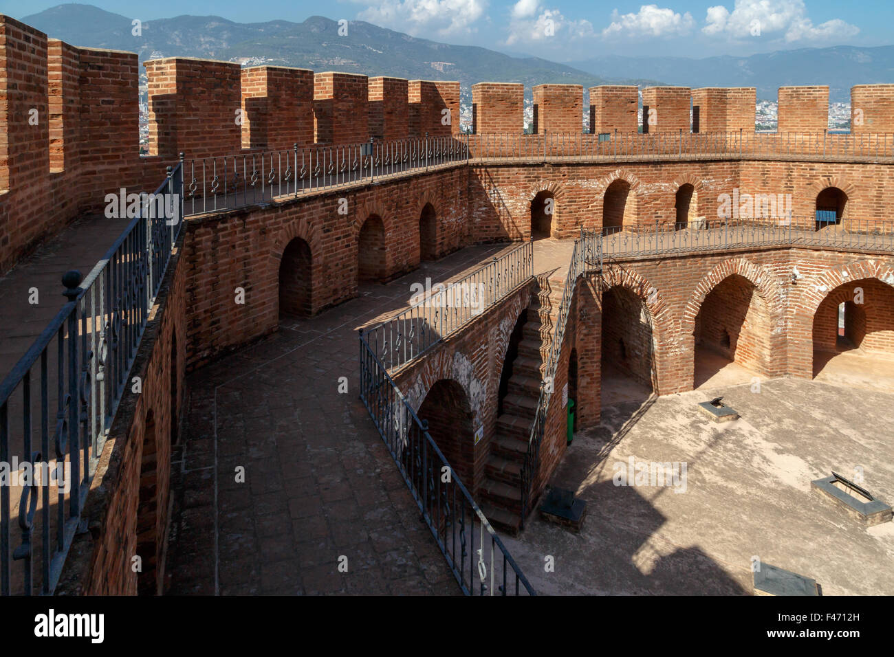 View of Alanya Red Tower in Antalya with orenge bricks, on bright blue ...