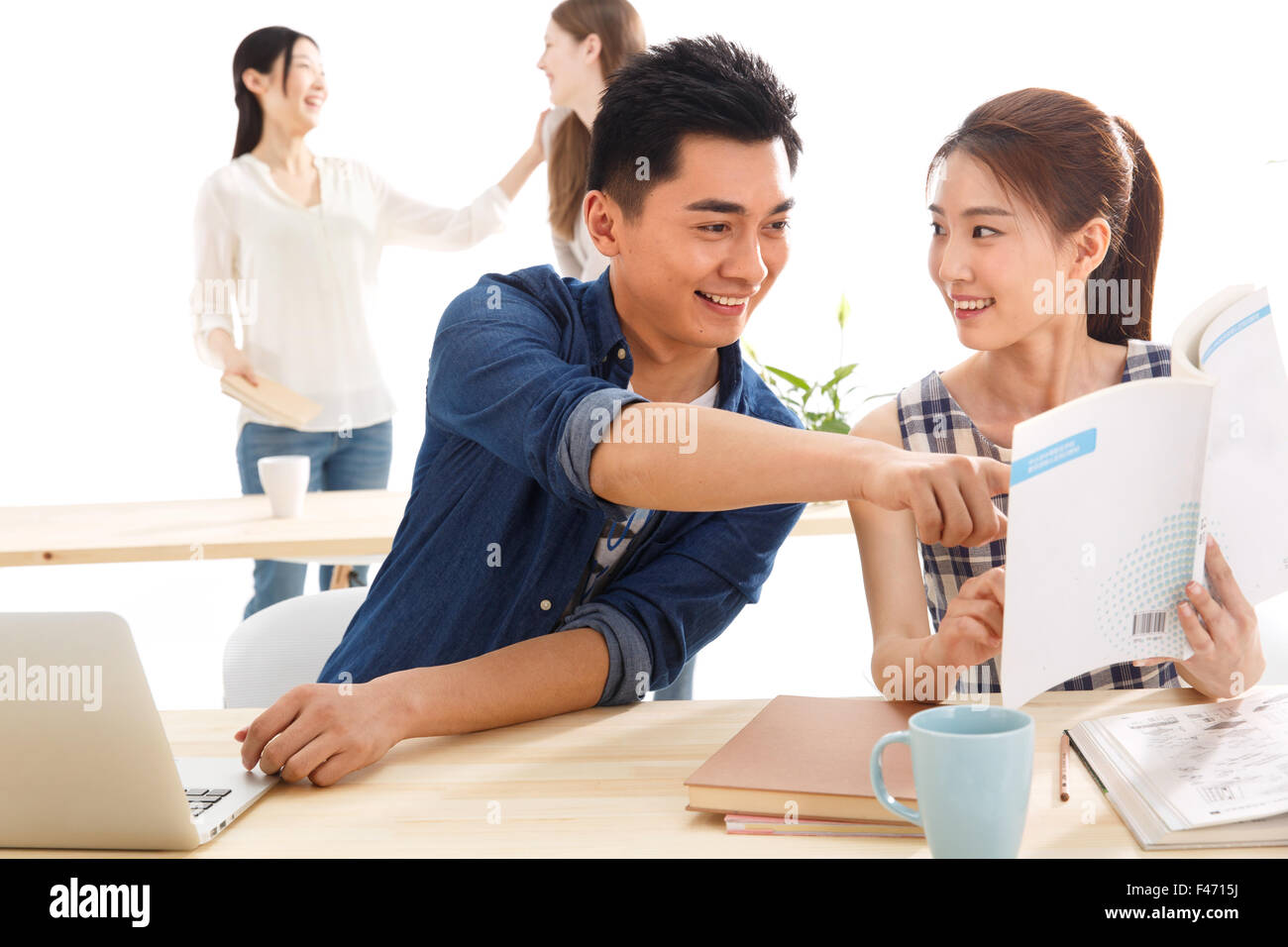Young people studying in classroom Stock Photo - Alamy