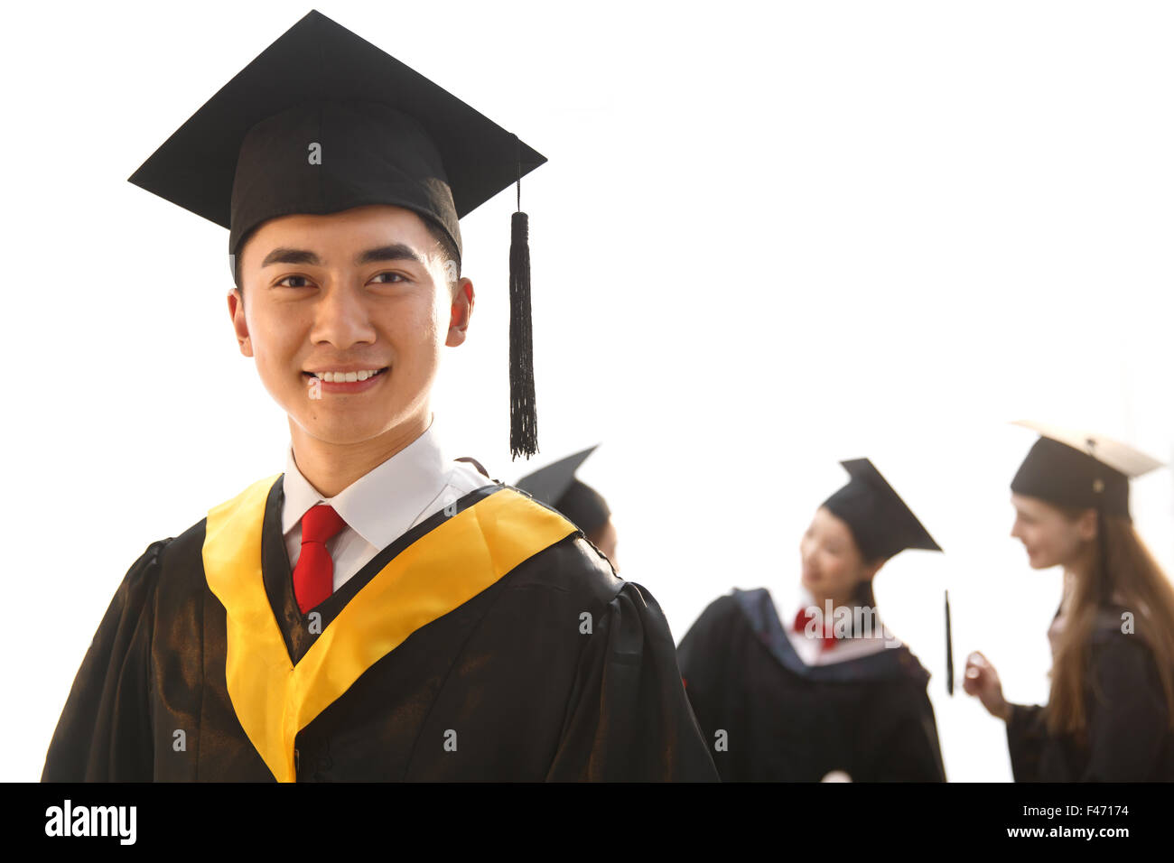 Students in graduation clothing Stock Photo - Alamy