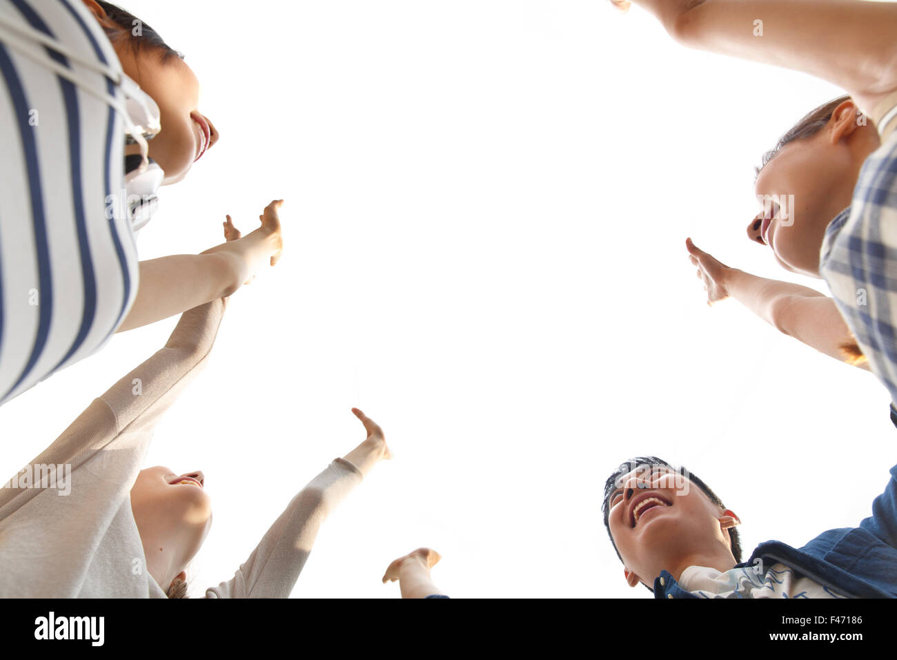 Group people circle arms hi-res stock photography and images - Alamy