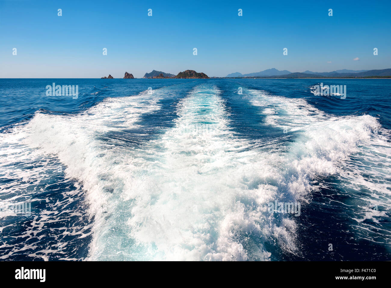 Waves on blue sea behind the boat Stock Photo - Alamy