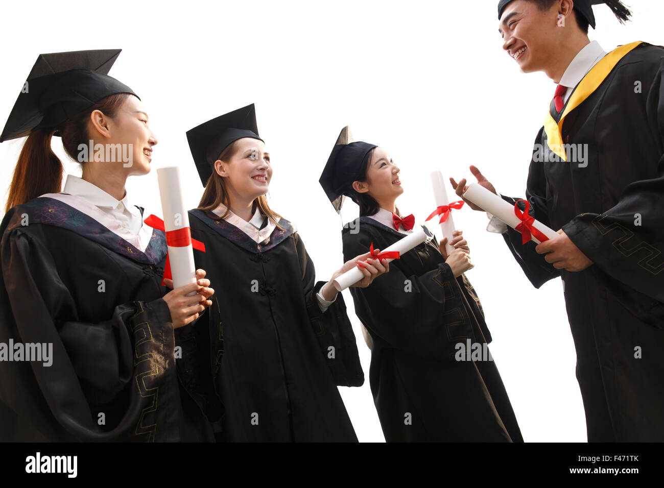 Students in graduation clothing Stock Photo - Alamy