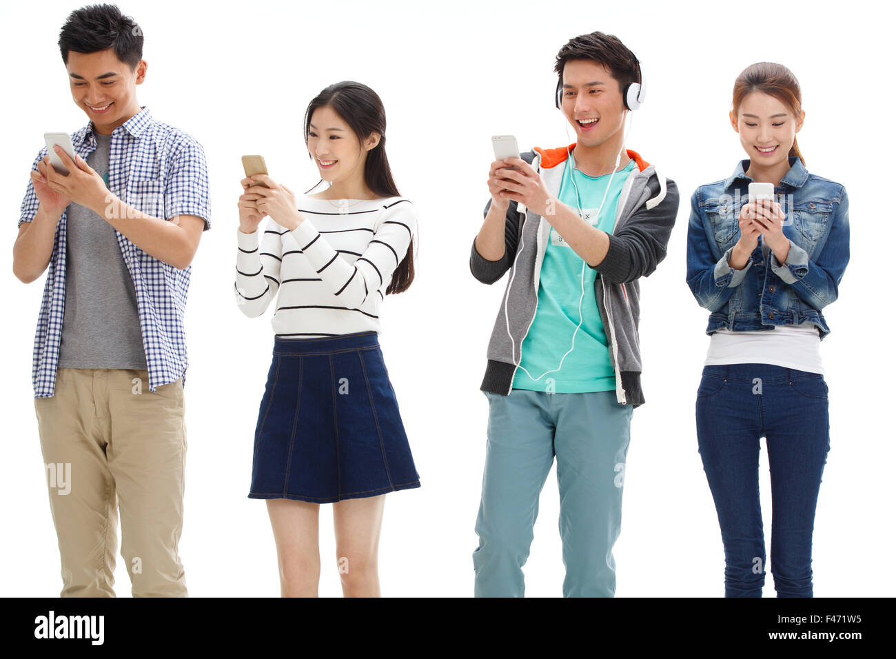 Portrait of four young people with cell phone Stock Photo - Alamy