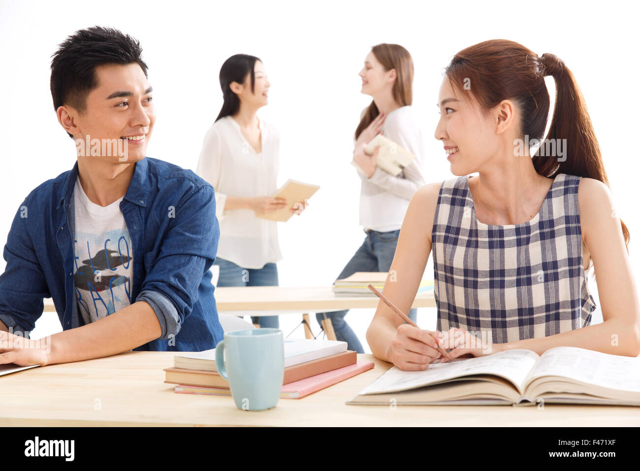 Young people in classroom Stock Photo - Alamy