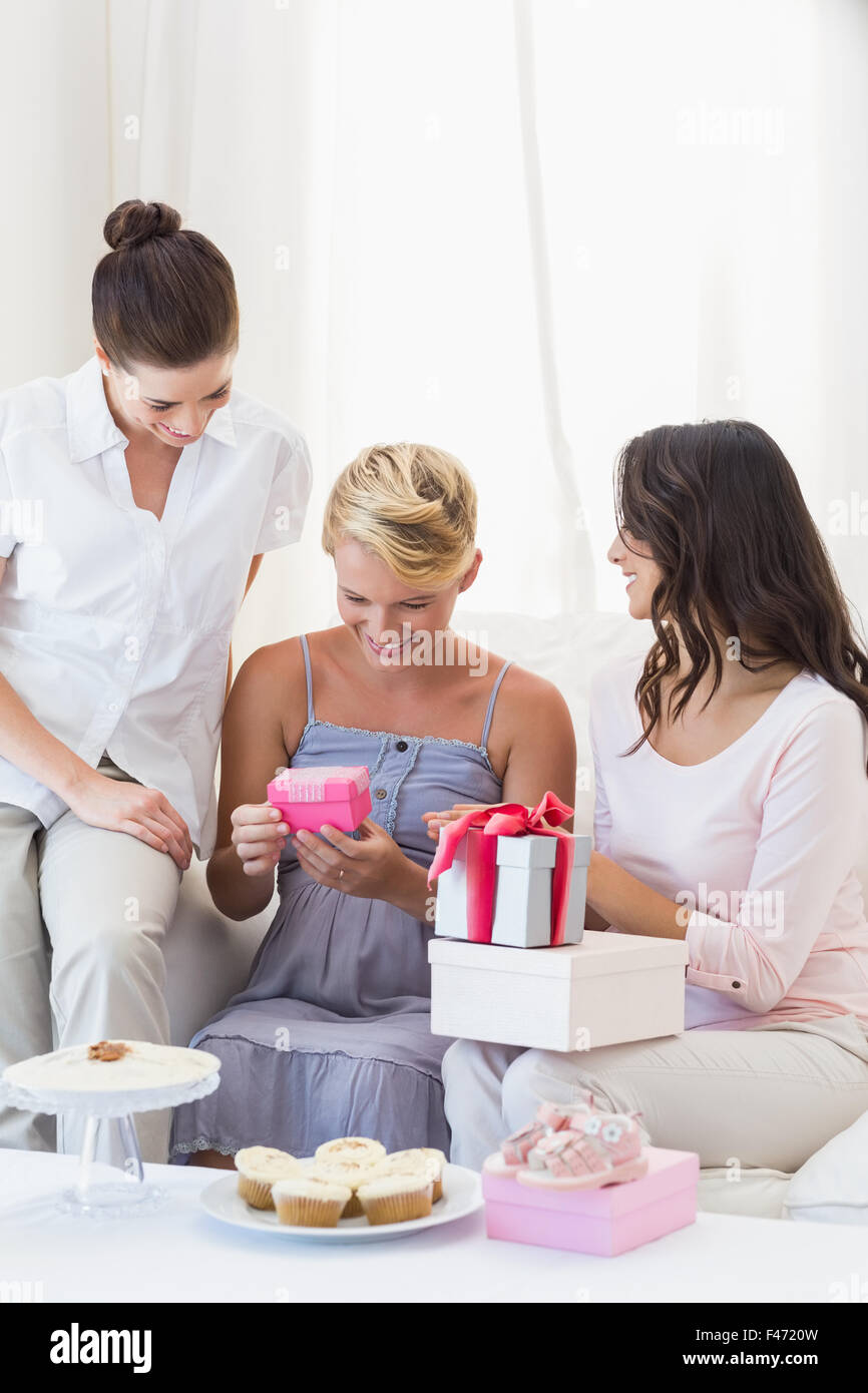 Pregnant woman receiving a baby gift Stock Photo - Alamy