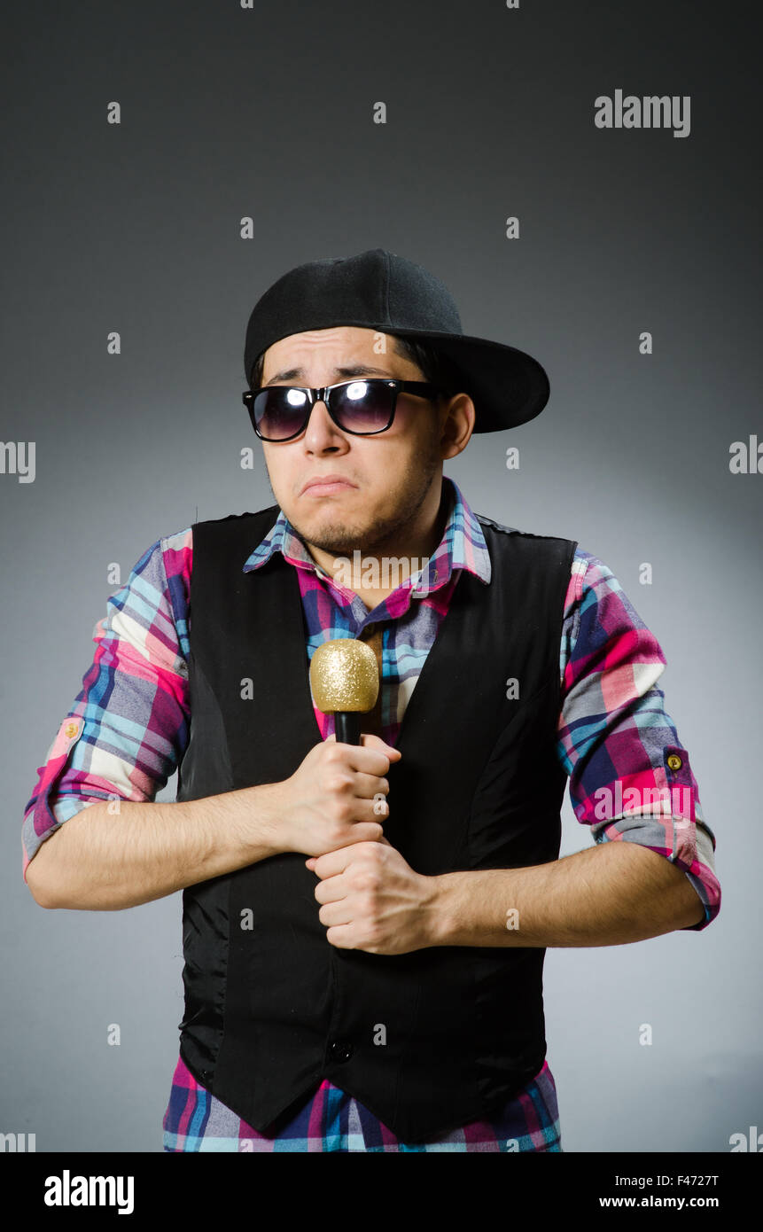 Funny man singing in karaoke Stock Photo - Alamy