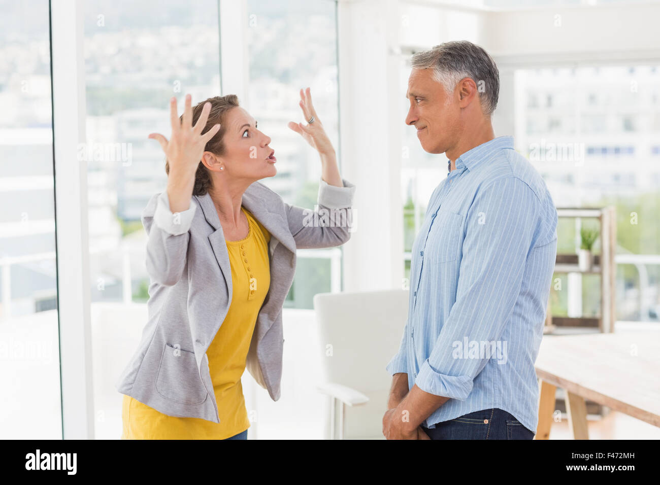 Creative business people having a disagreement Stock Photo - Alamy