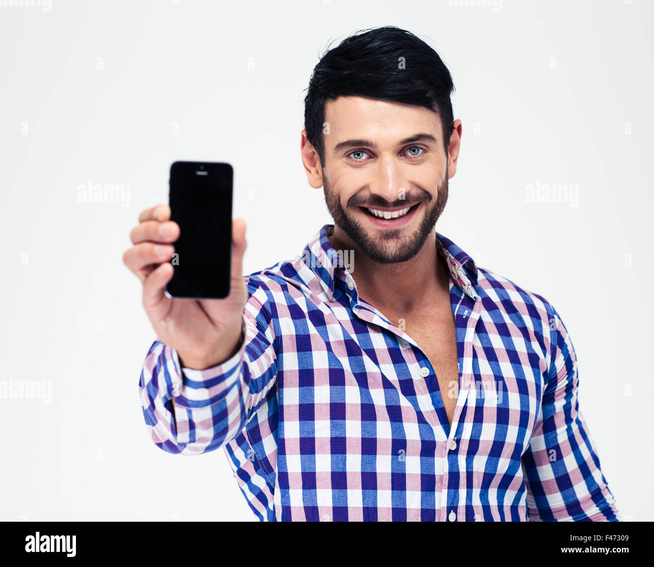 Potrait of a smiling man showing blank smartphone screen isolated on a ...