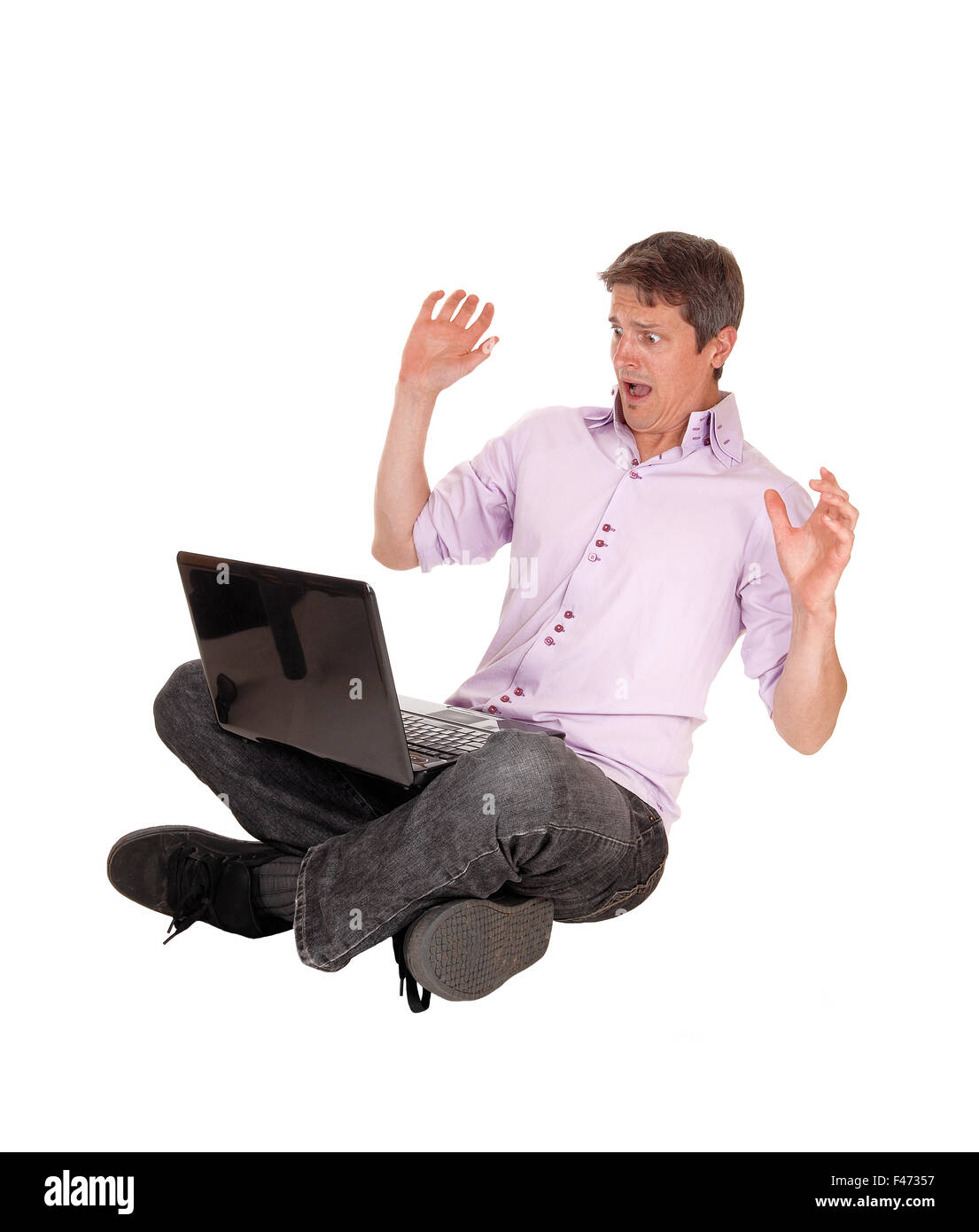 Scared man from his laptop Stock Photo - Alamy