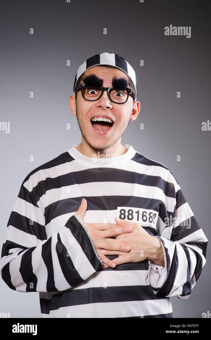 Funny prisoner isolated on gray Stock Photo - Alamy