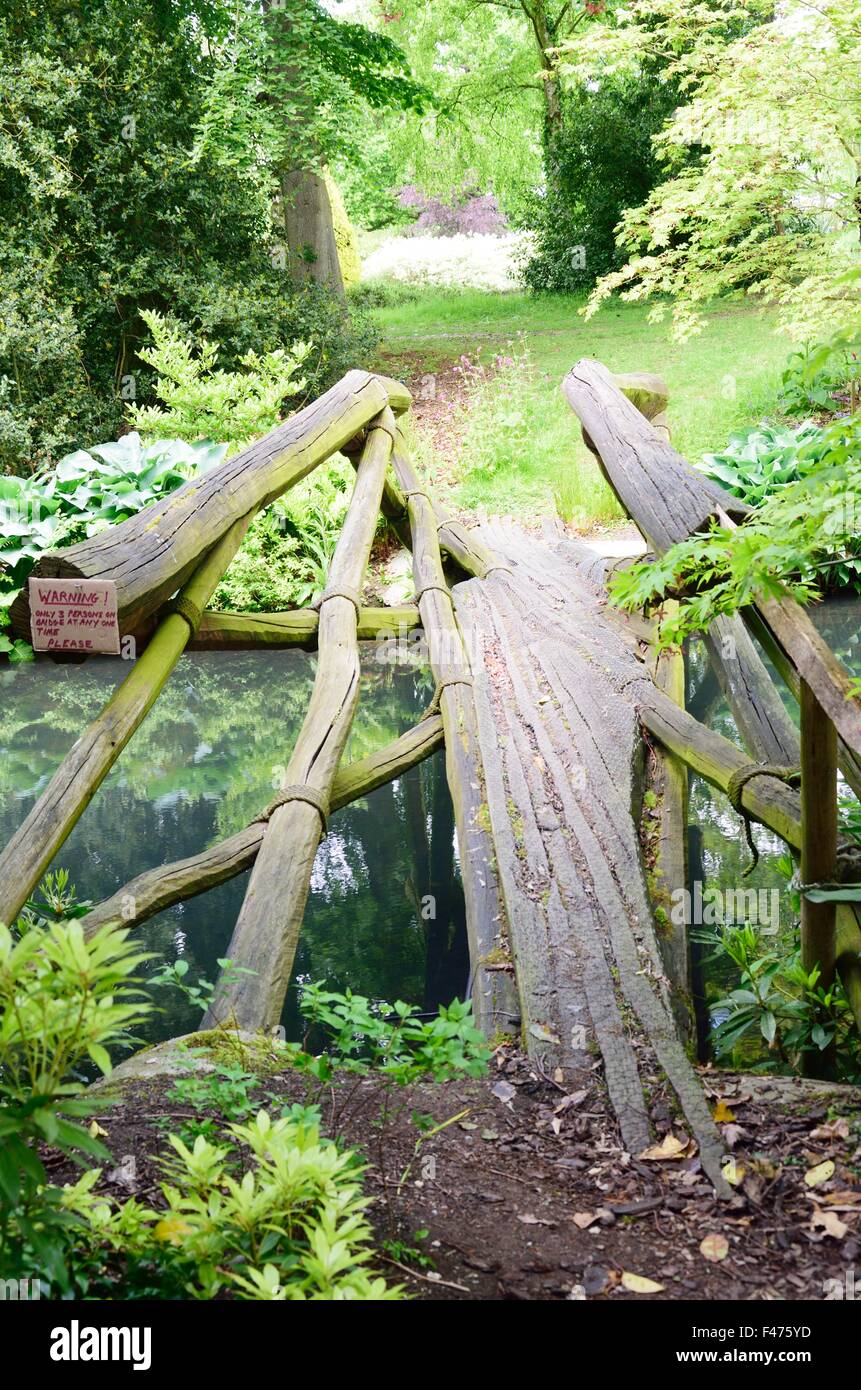 Narrow wooden bridge over stream Stock Photo - Alamy