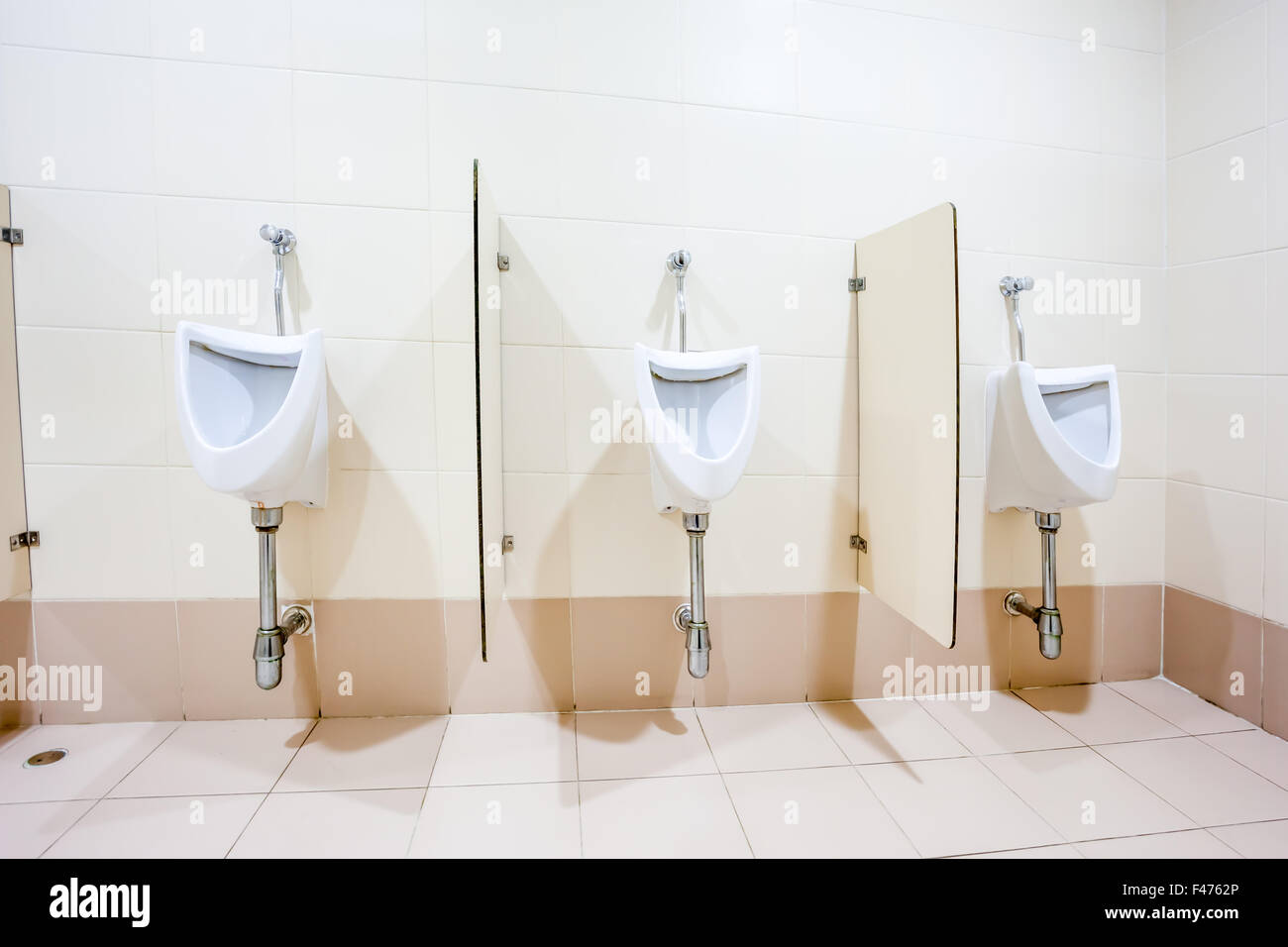 urinals in an old building for men only Stock Photo - Alamy