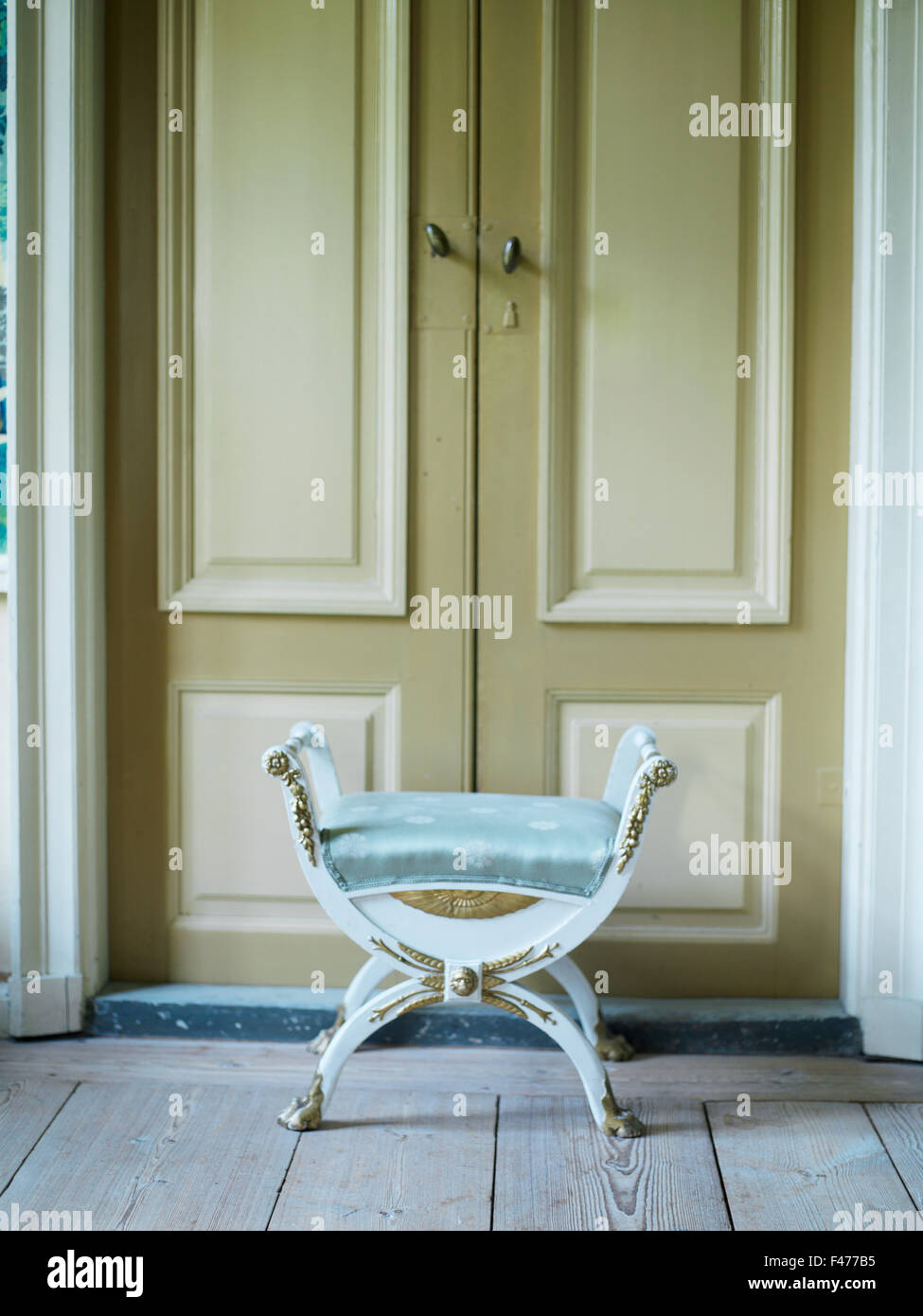 A stool and a door Stock Photo - Alamy