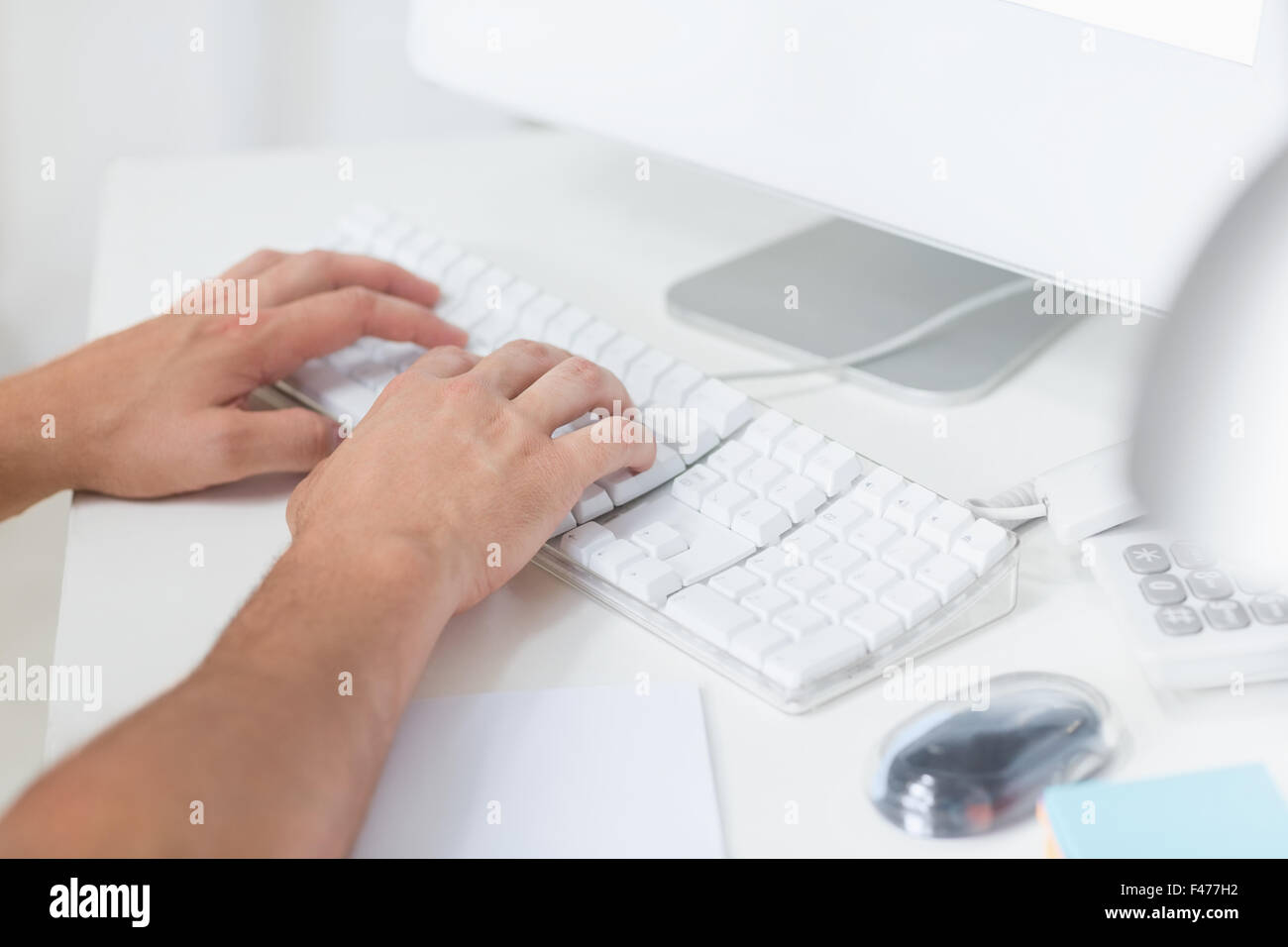 Man typing on computer keyboard Stock Photo - Alamy