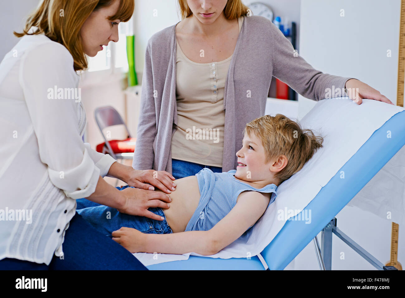 ABDOMEN PALPATION, CHILD Stock Photo - Alamy