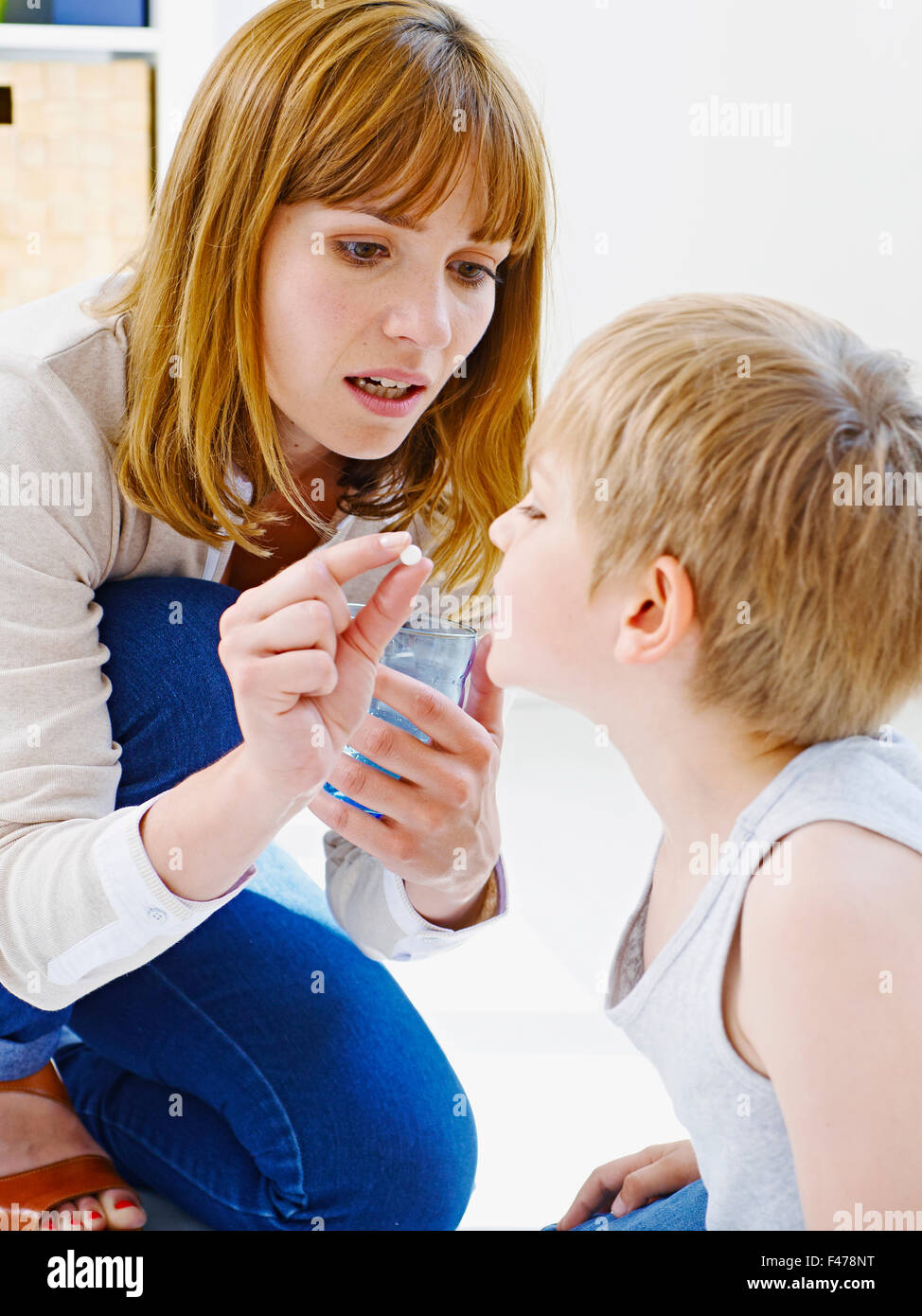 CHILD TAKING MEDICATION Stock Photo - Alamy